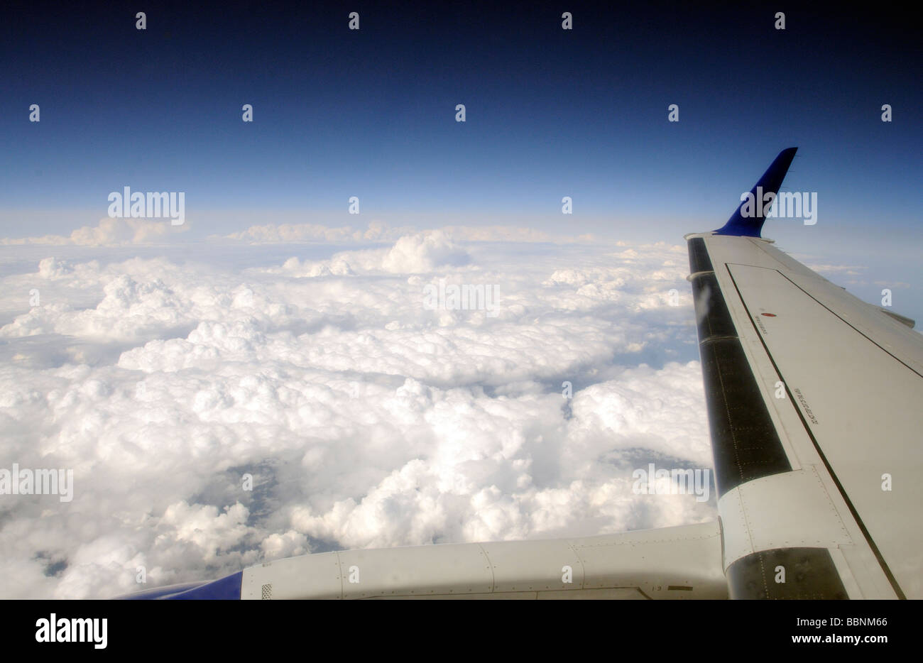 Cloud formation and aircraft wing Stock Photo - Alamy