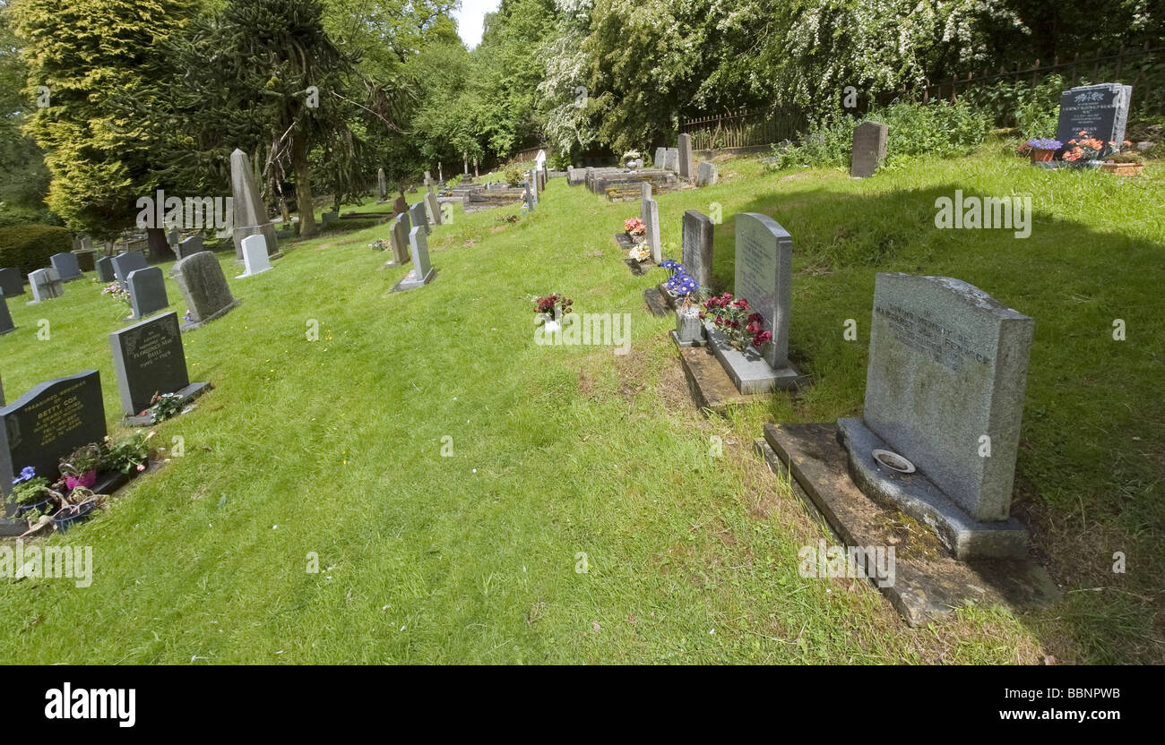 gravestones lit by the sun in a country cemetery Stock Photo - Alamy