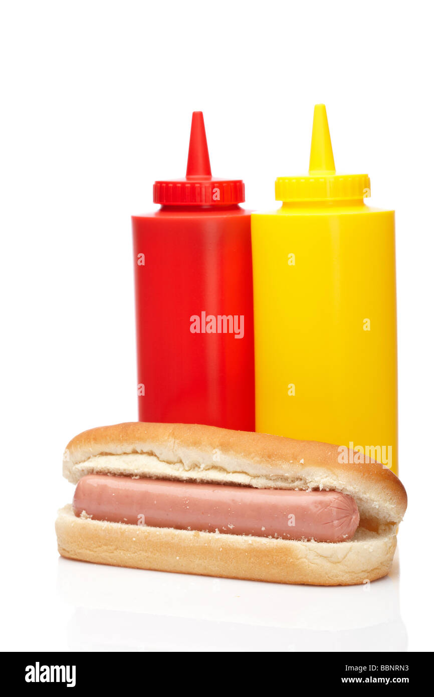 A hot dog with ketchup and mustard bottles isolated on white background ...