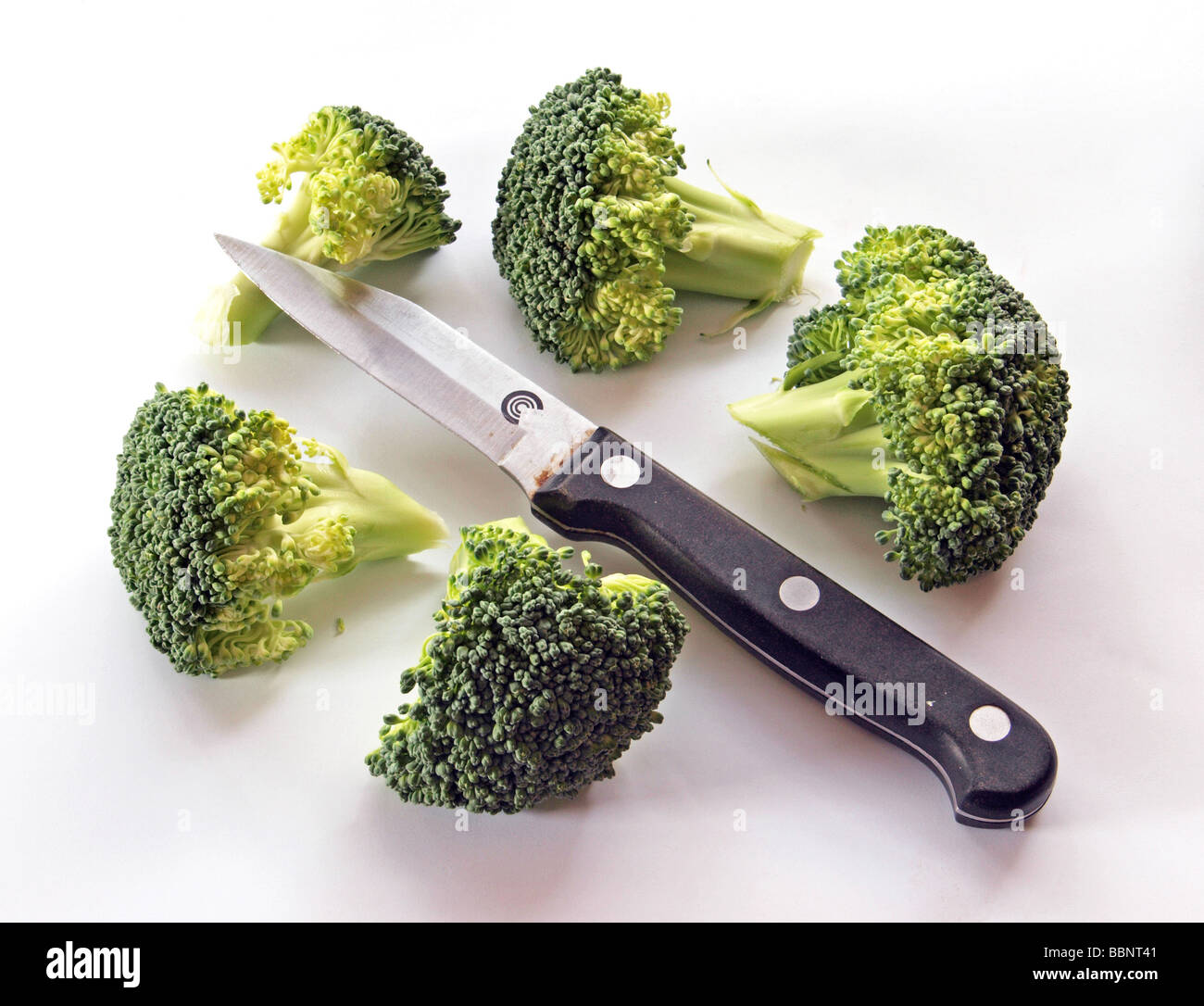 Freshly cut broccoli with a vegetable knife Stock Photo - Alamy