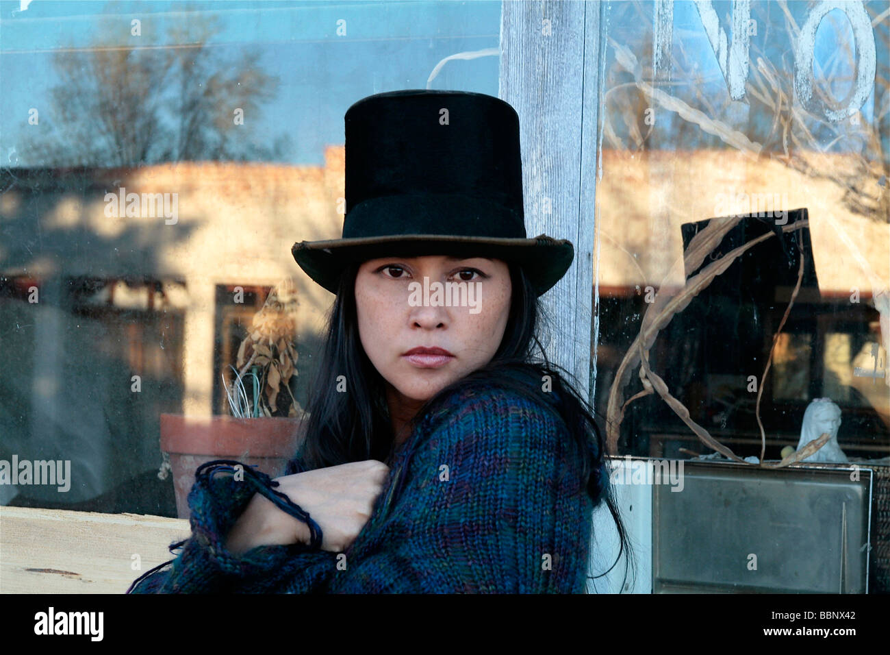 Beautiful Native American girl in vintage top hat just off old Route 66 ...