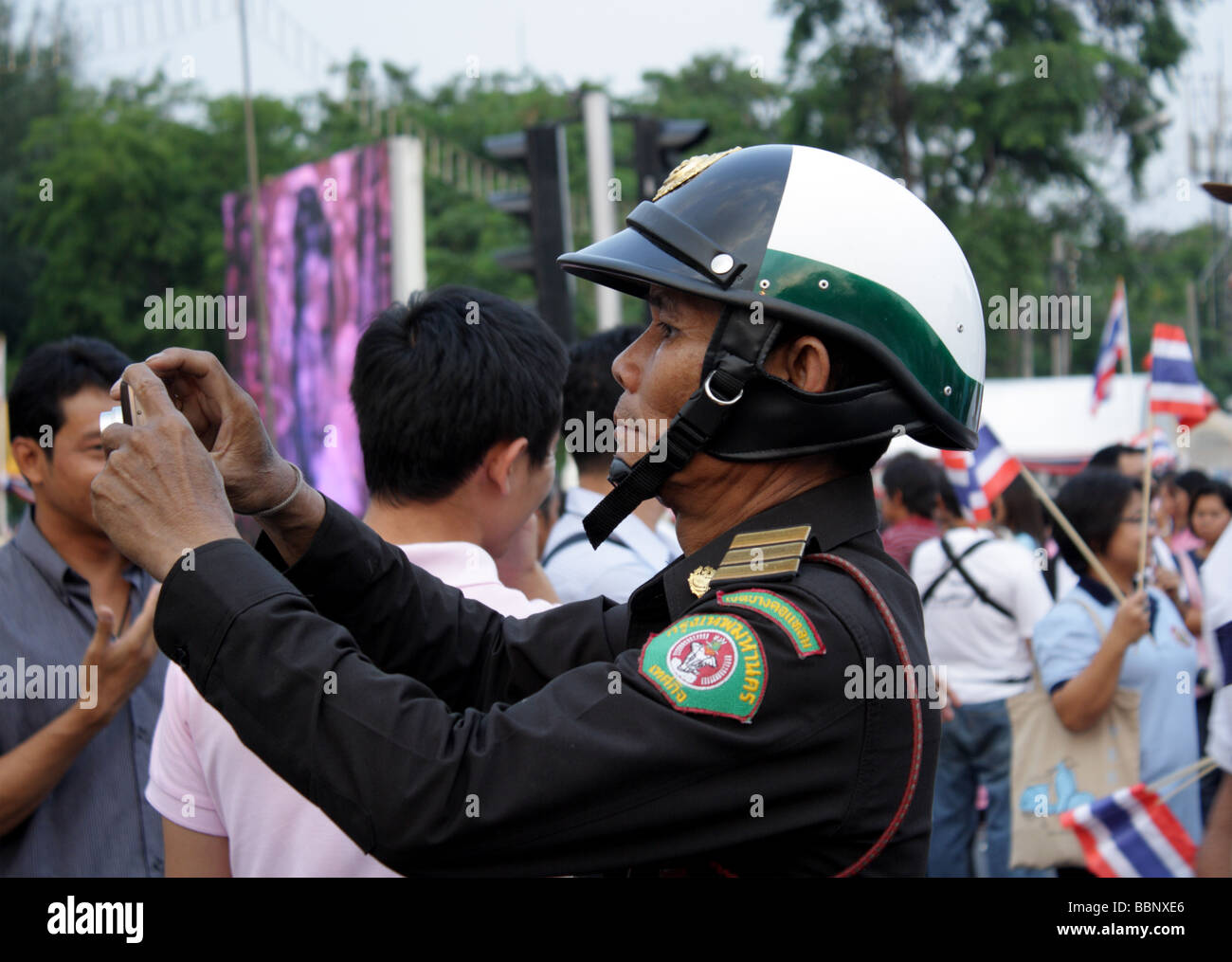 Thai policeman taking photo Stock Photo - Alamy