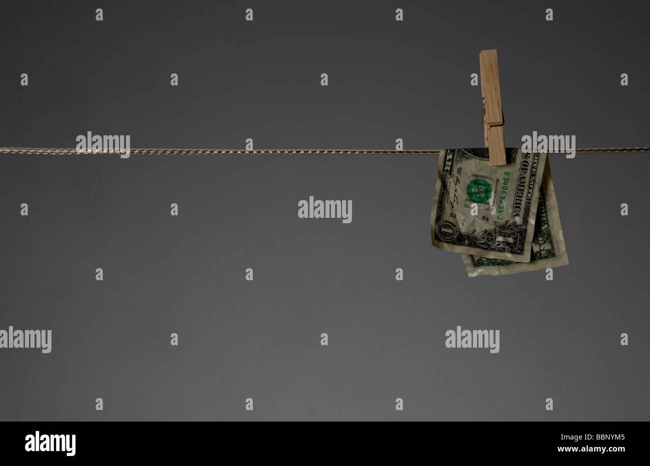 dollar bill on washing line Stock Photo - Alamy