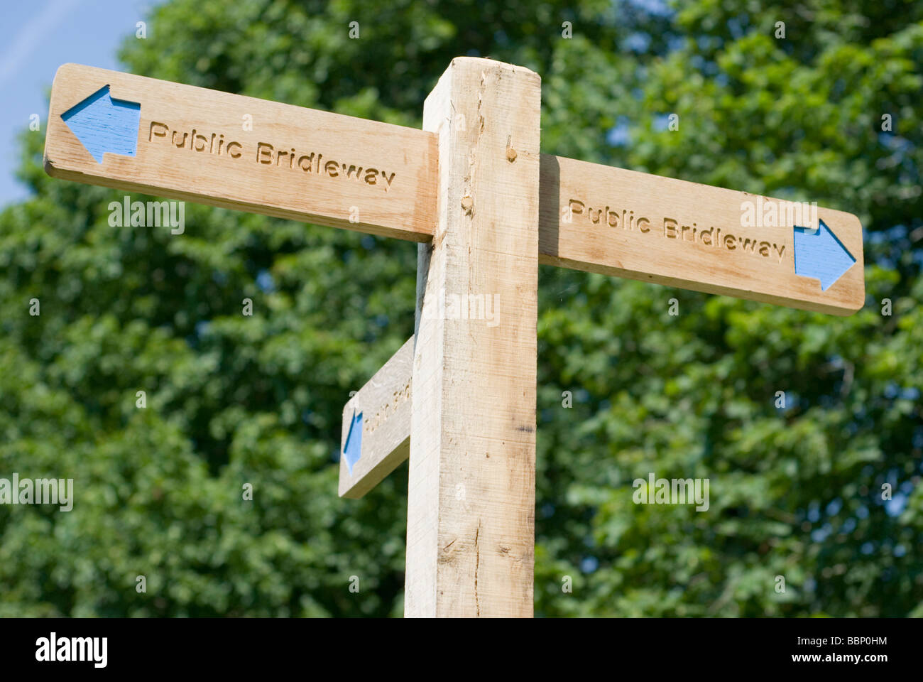 Wooden 3 way Public Bridleway sign post Stock Photo - Alamy