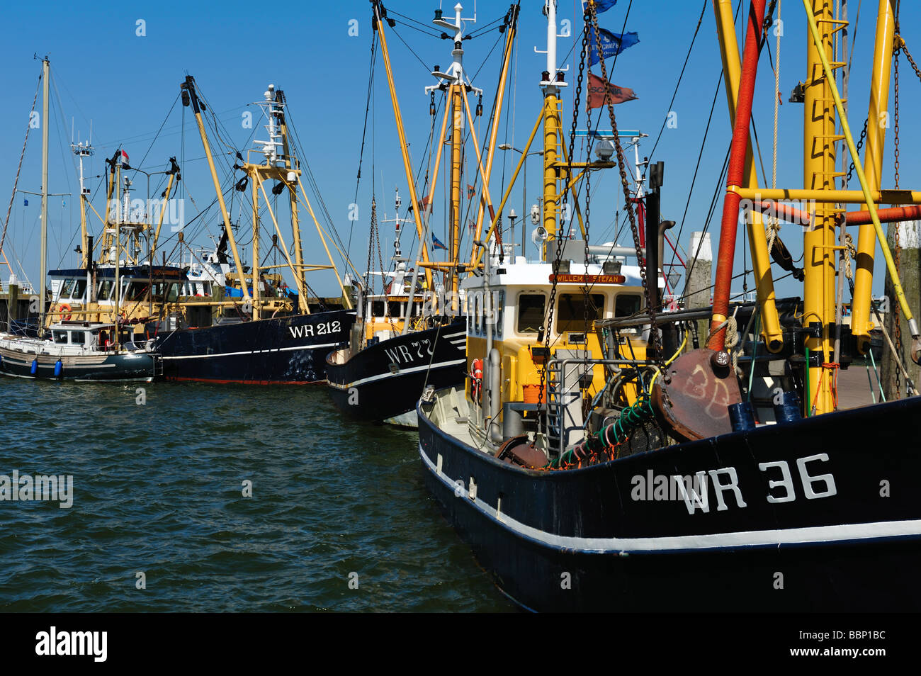 Fishing trawlers in the harbor of Den Oever The Netherlands Stock Photo ...