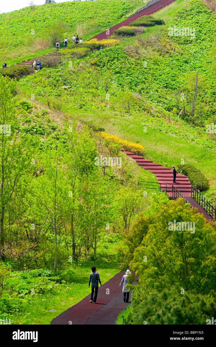 A long red path leads visitors up to the crater of Mt Usu zan a still ...