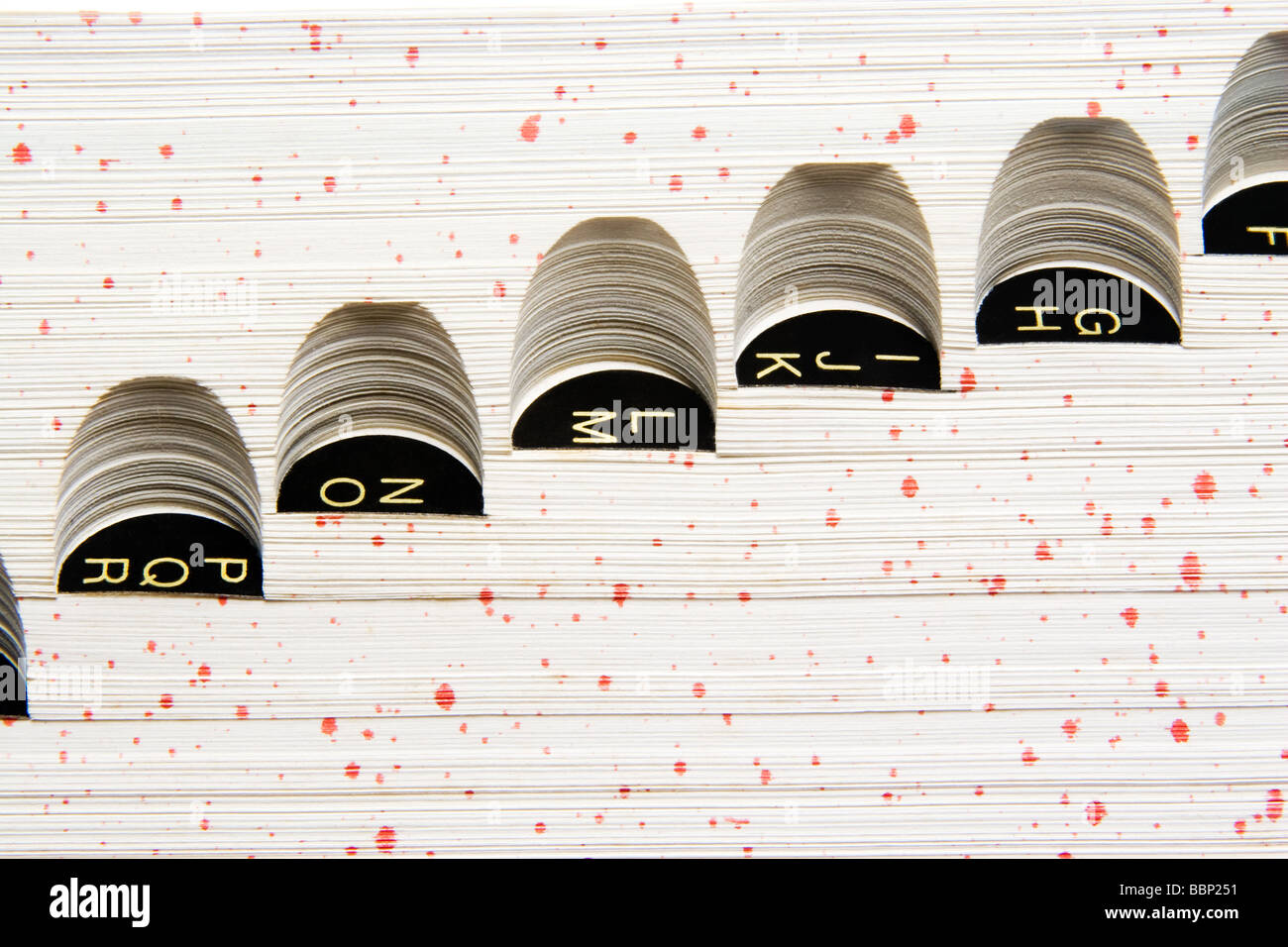 Close up of dictionary side with gold lettered tabs Stock Photo - Alamy