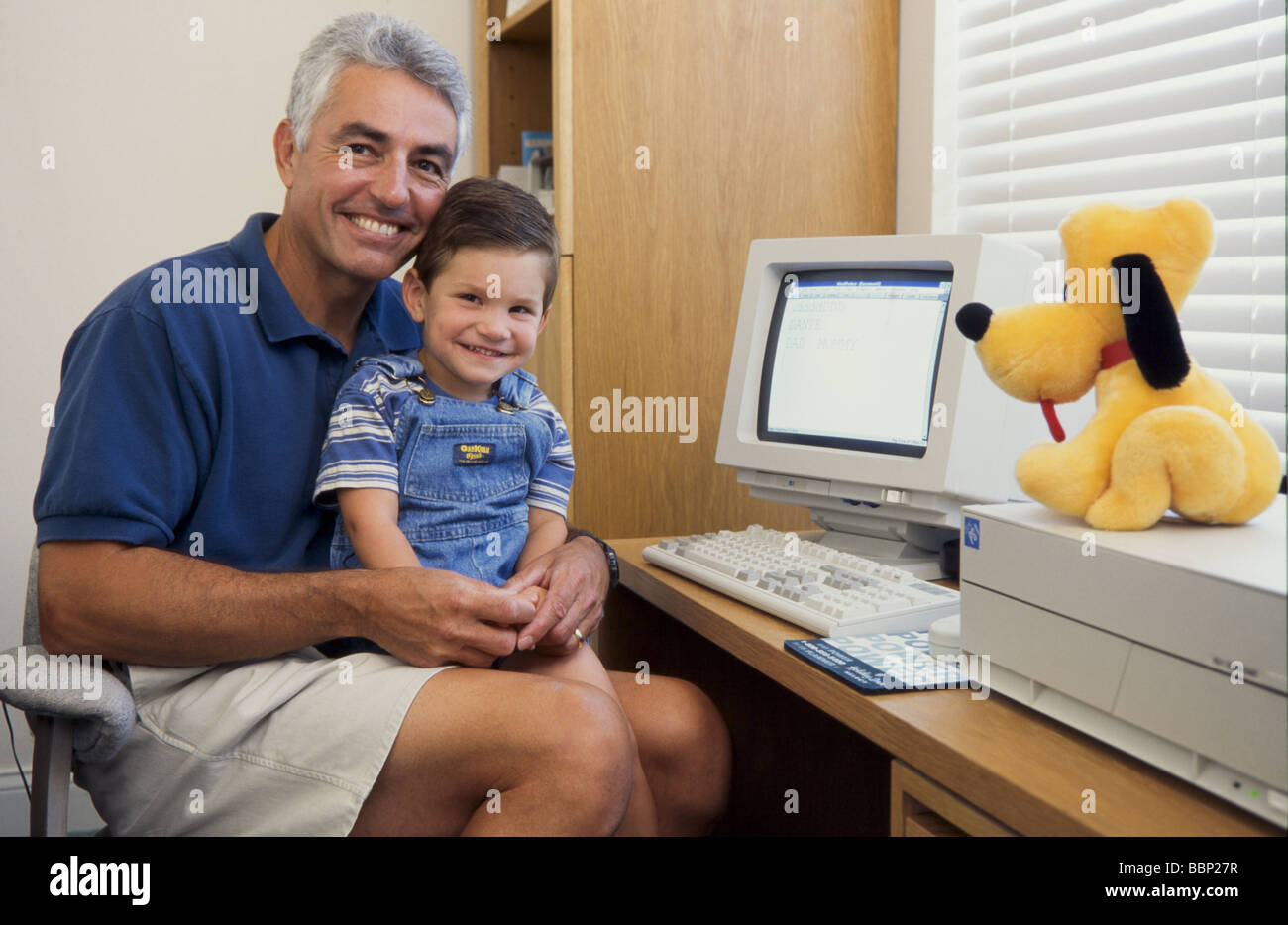 Father and son at computer Stock Photo - Alamy