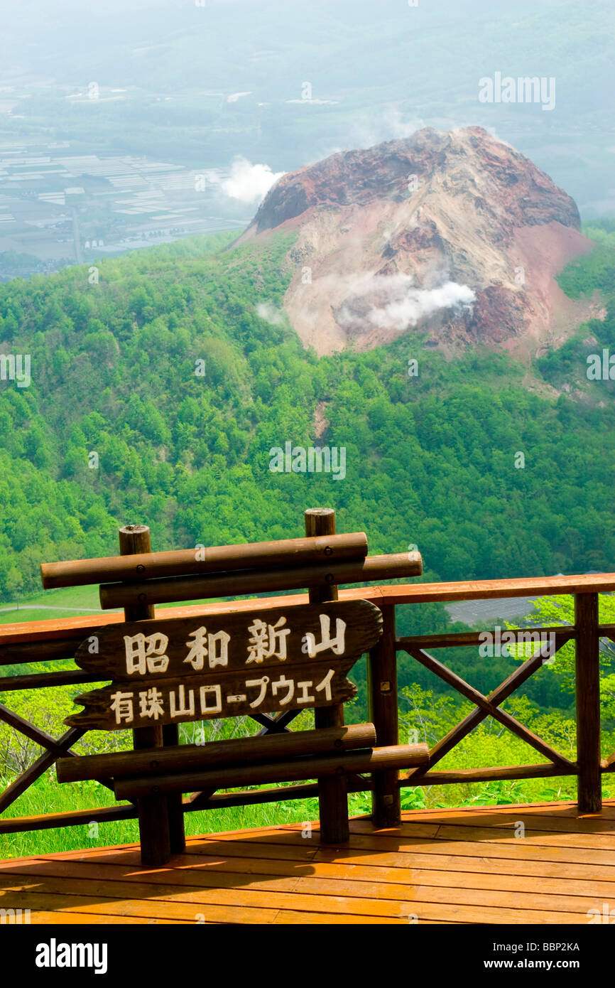 A sign in Japanese reads Mt Showa shinzan Mt Usu zan ropeway Mt Showa ...