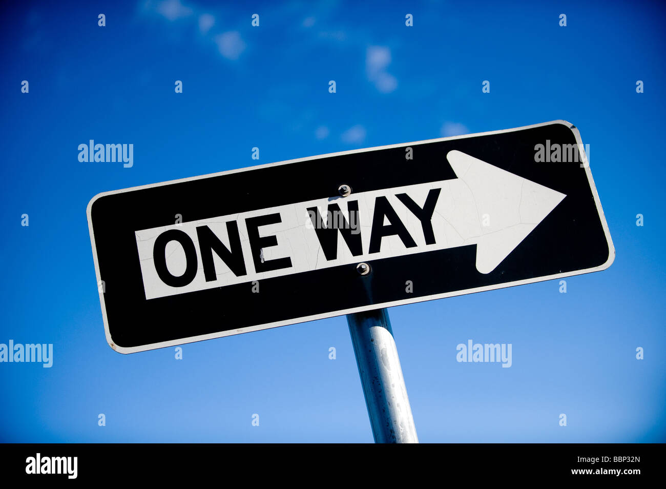 One Way Sign with blue sky Stock Photo - Alamy