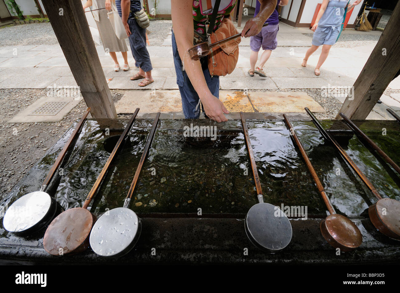 Purification water for prayers at the entrance of Kotoku-in Temple ...