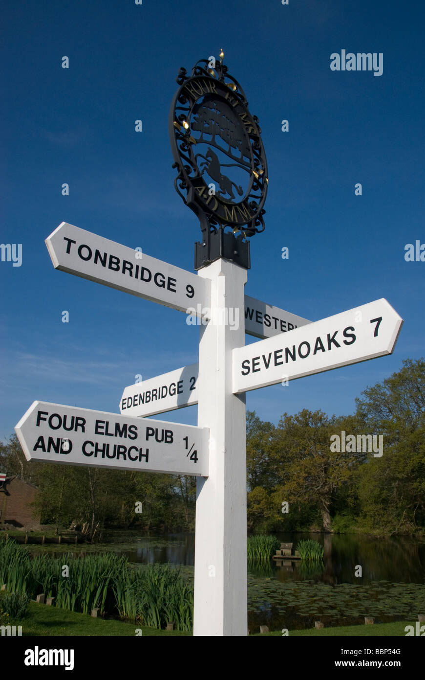 Signpost and village sign, Four Elms, near Westerham, Kent, England, UK ...