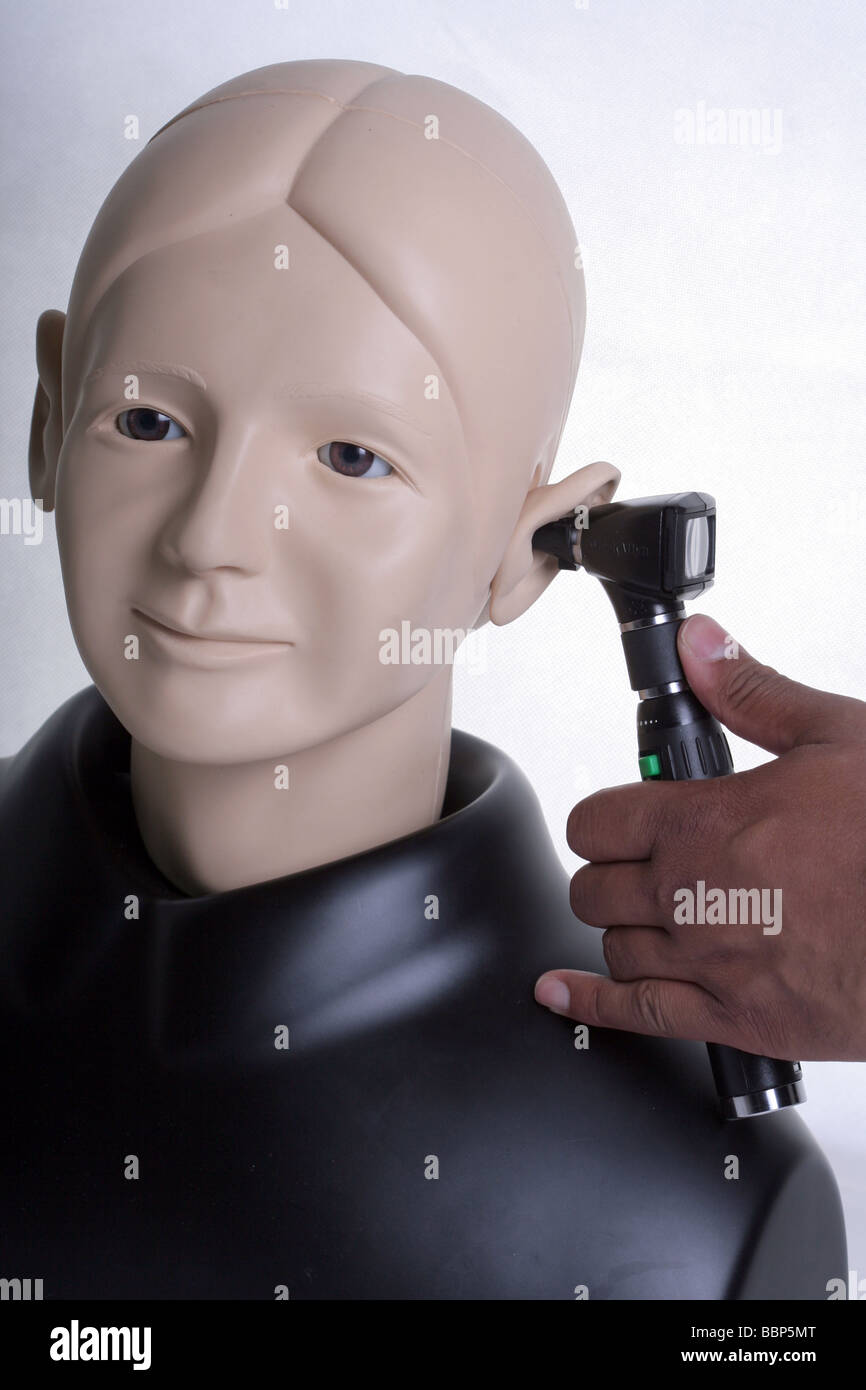 Dummy used in audiologist test using auriscope Stock Photo - Alamy