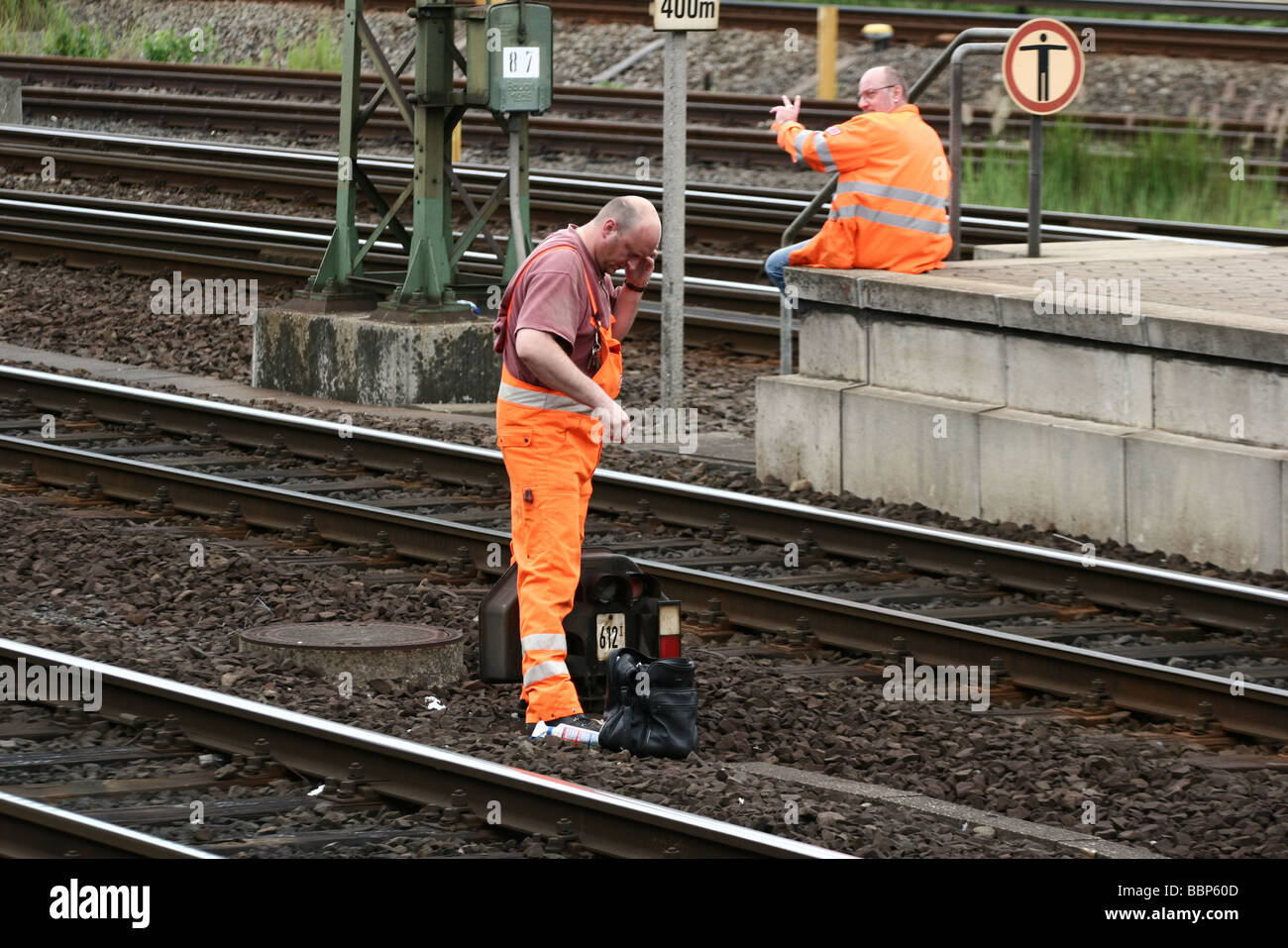 Workers on a railway track in germany Stock Photo - Alamy