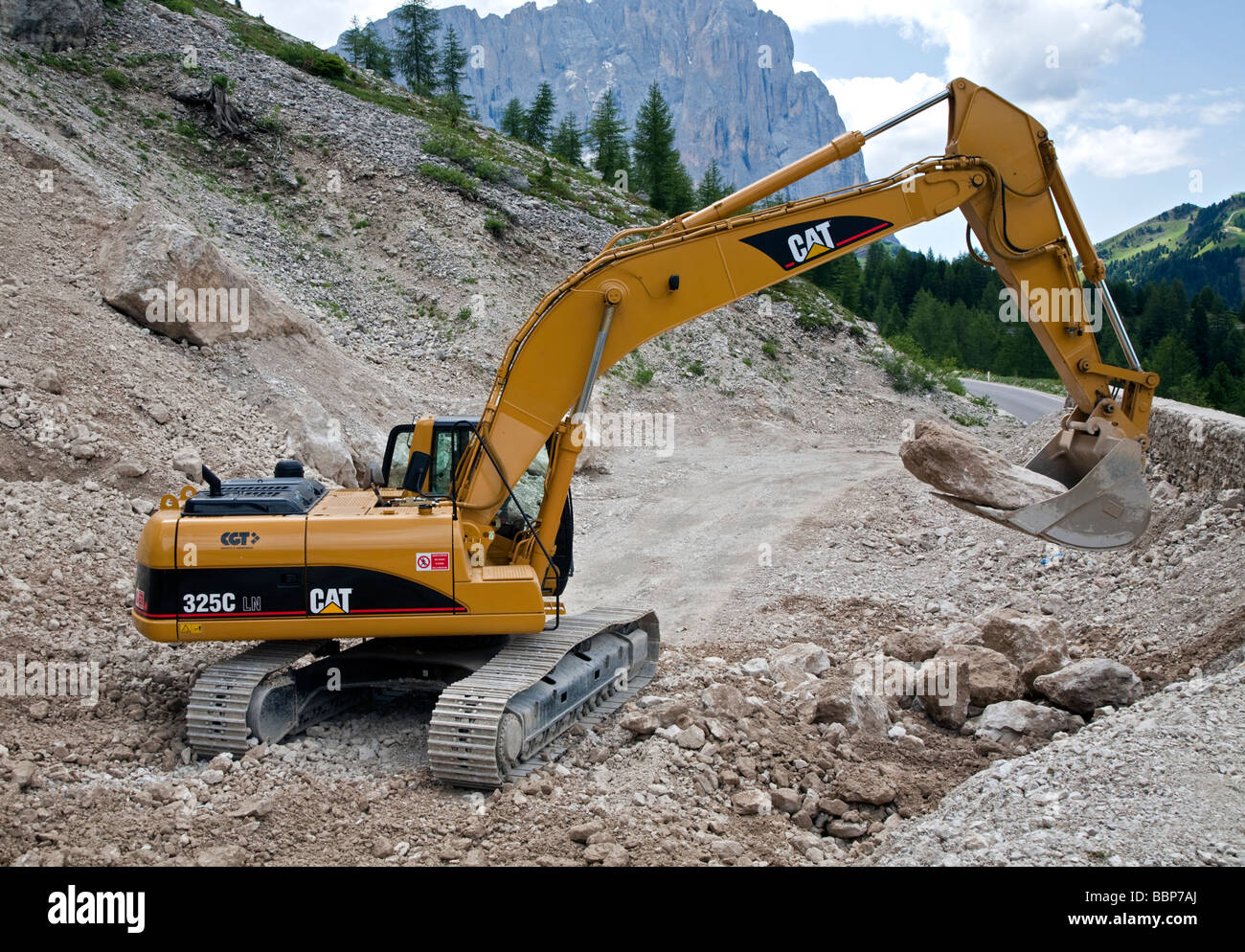 Yellow Caterpillar Mechanical Digger, Val Gardena, Italy Stock Photo ...