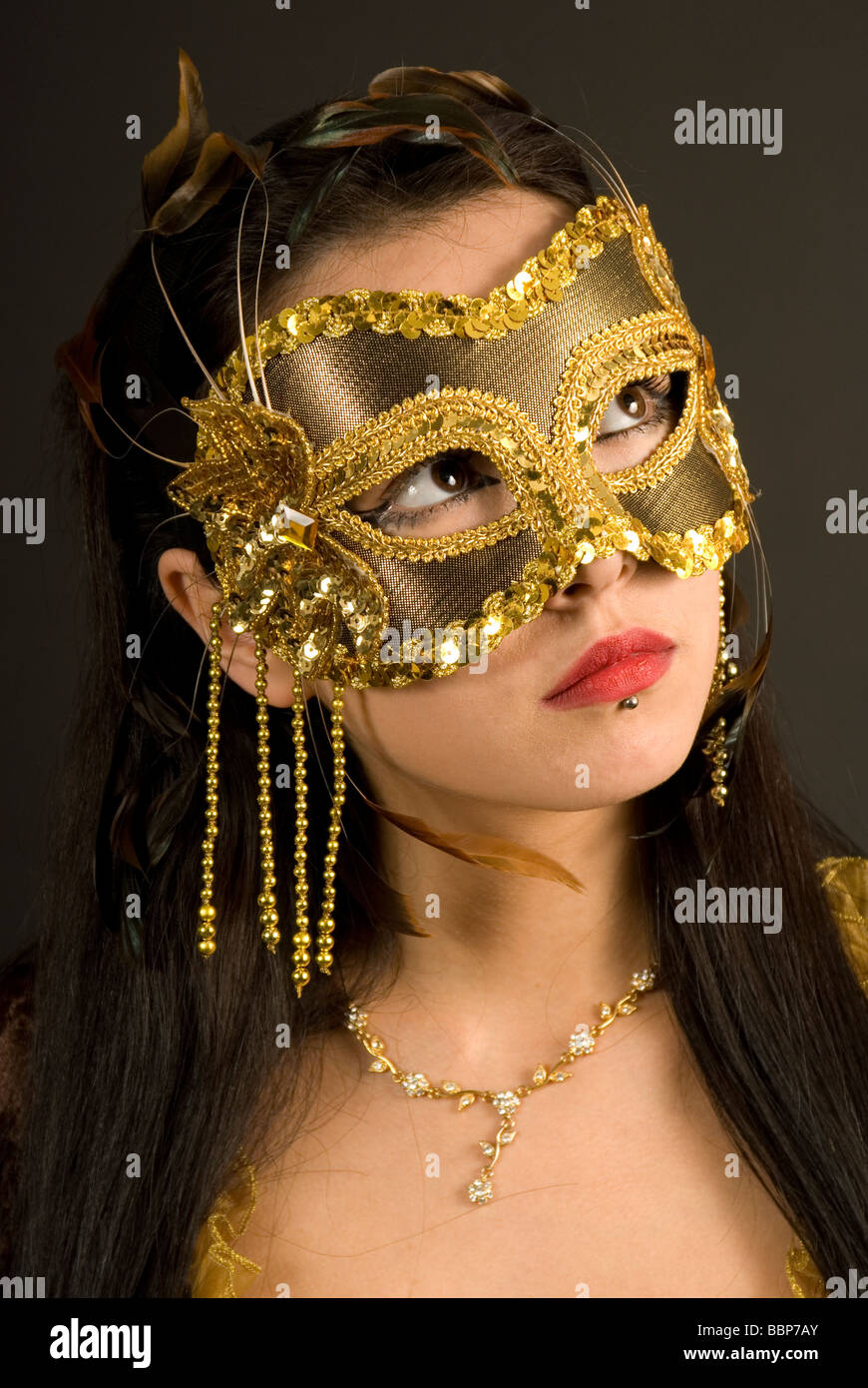 Gold masquerade mask hi-res stock photography and images - Alamy