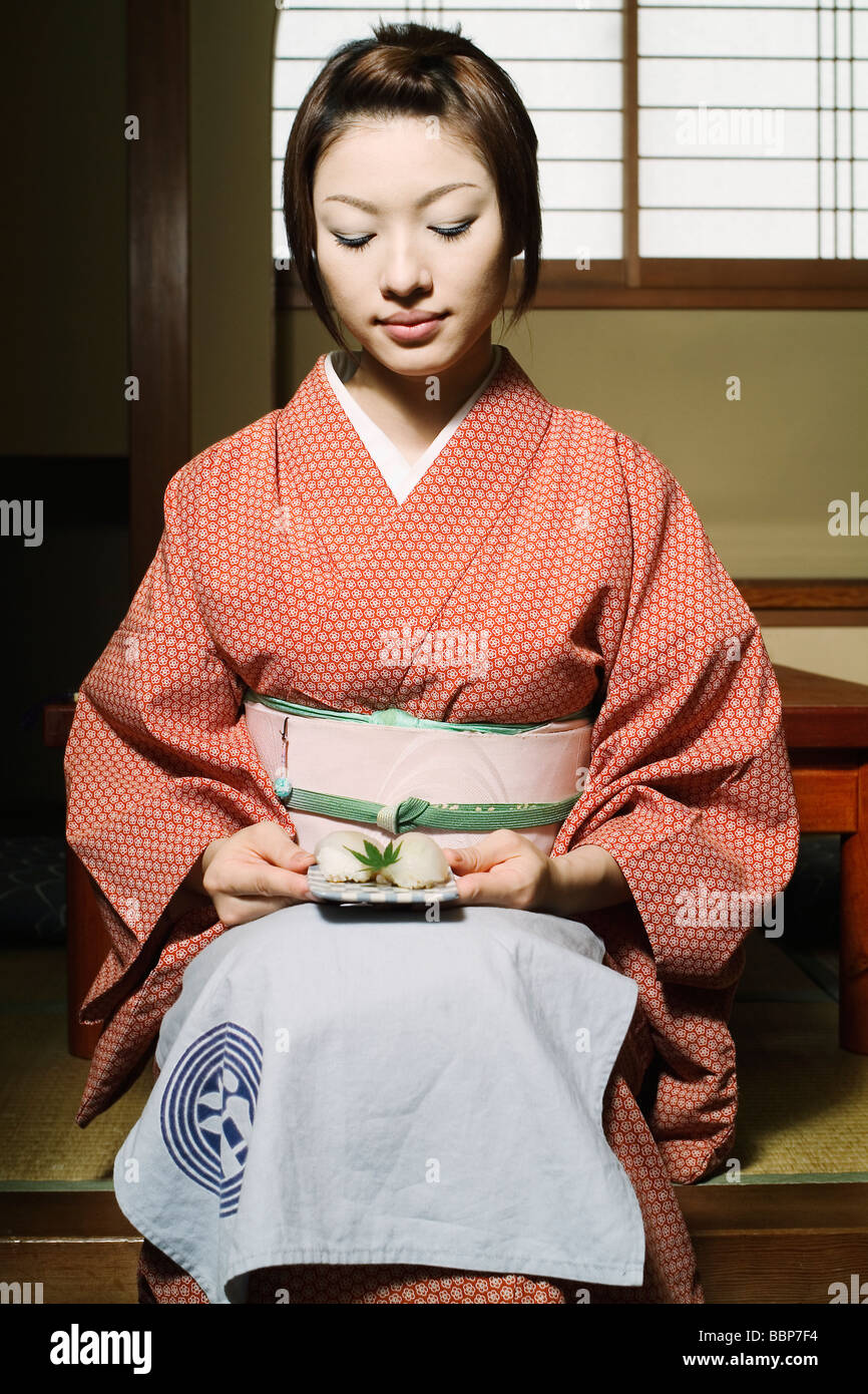 A waitress with Japanese food Stock Photo - Alamy