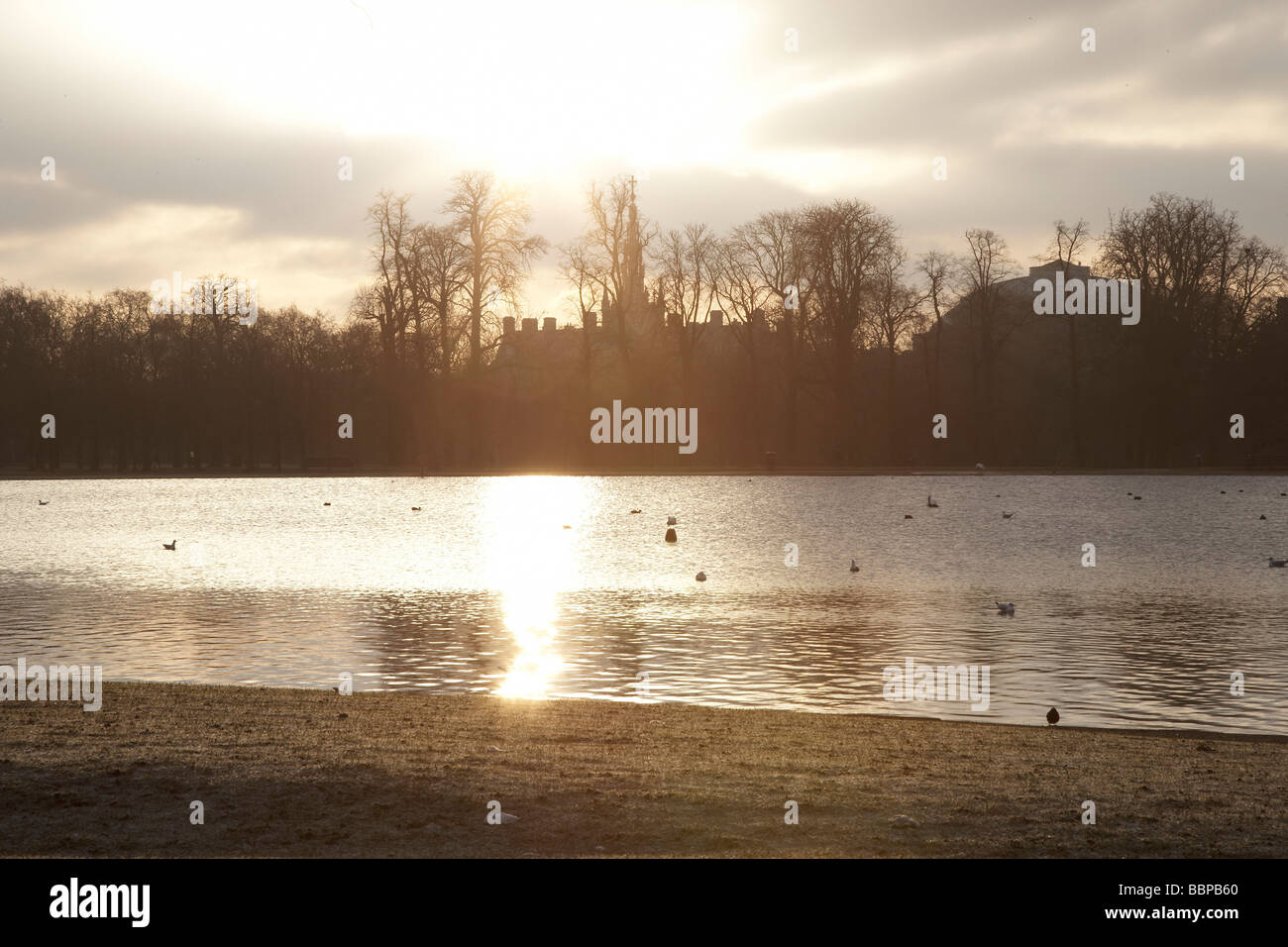 Sunset reflecting across water Stock Photo - Alamy