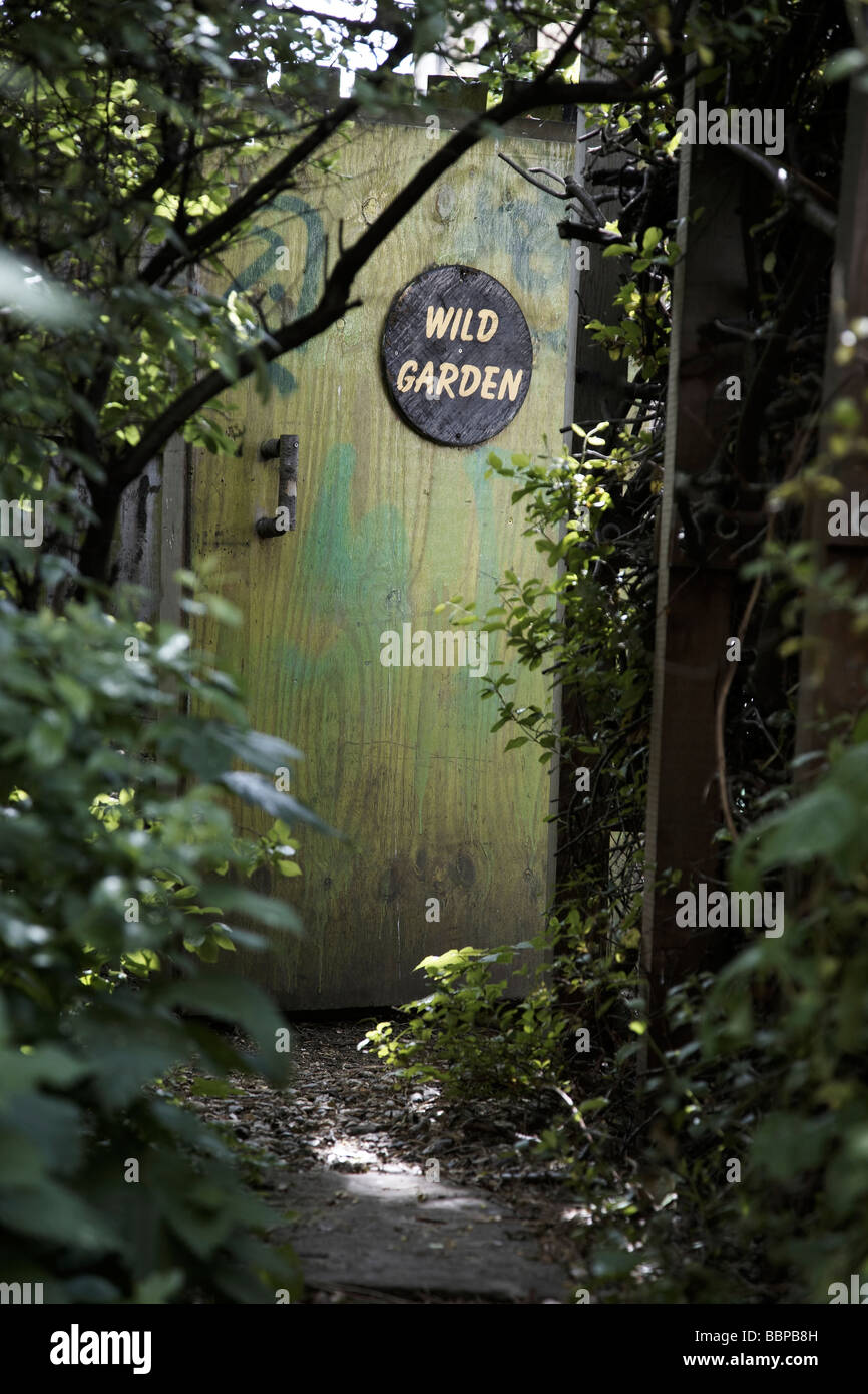 Door to a wild garden in woods Stock Photo - Alamy