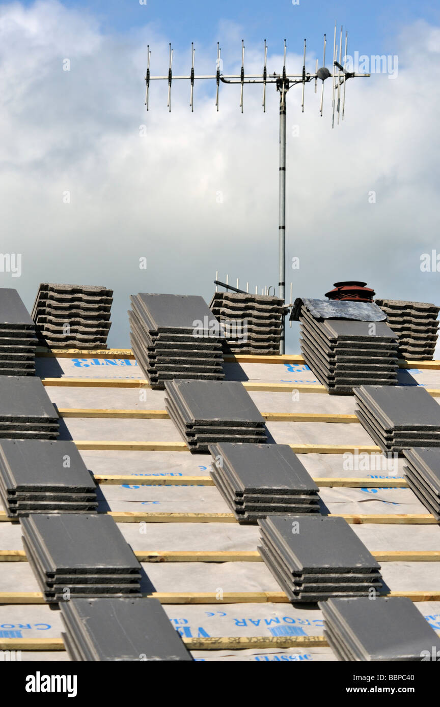 Roofing slates, stacked on roof, prior to re-roofing house Stock Photo ...