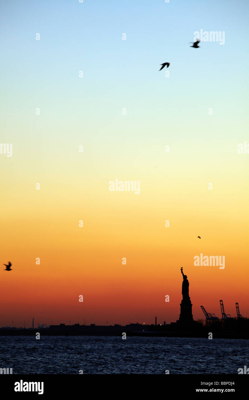 statue of liberty at sunset, New York Stock Photo - Alamy