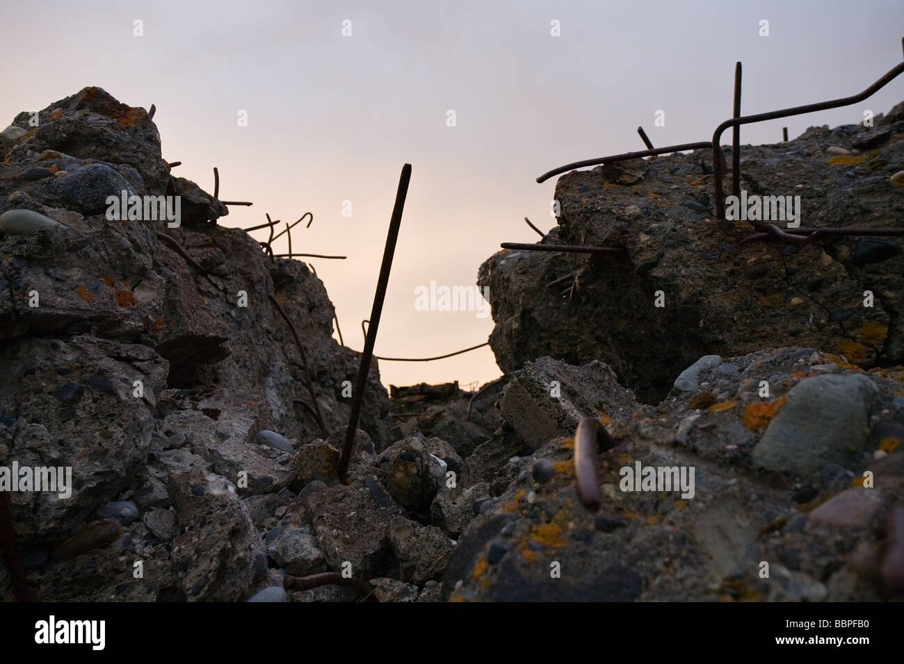 Heavenly gleam through stone fragments with iron rusty armature Stock ...