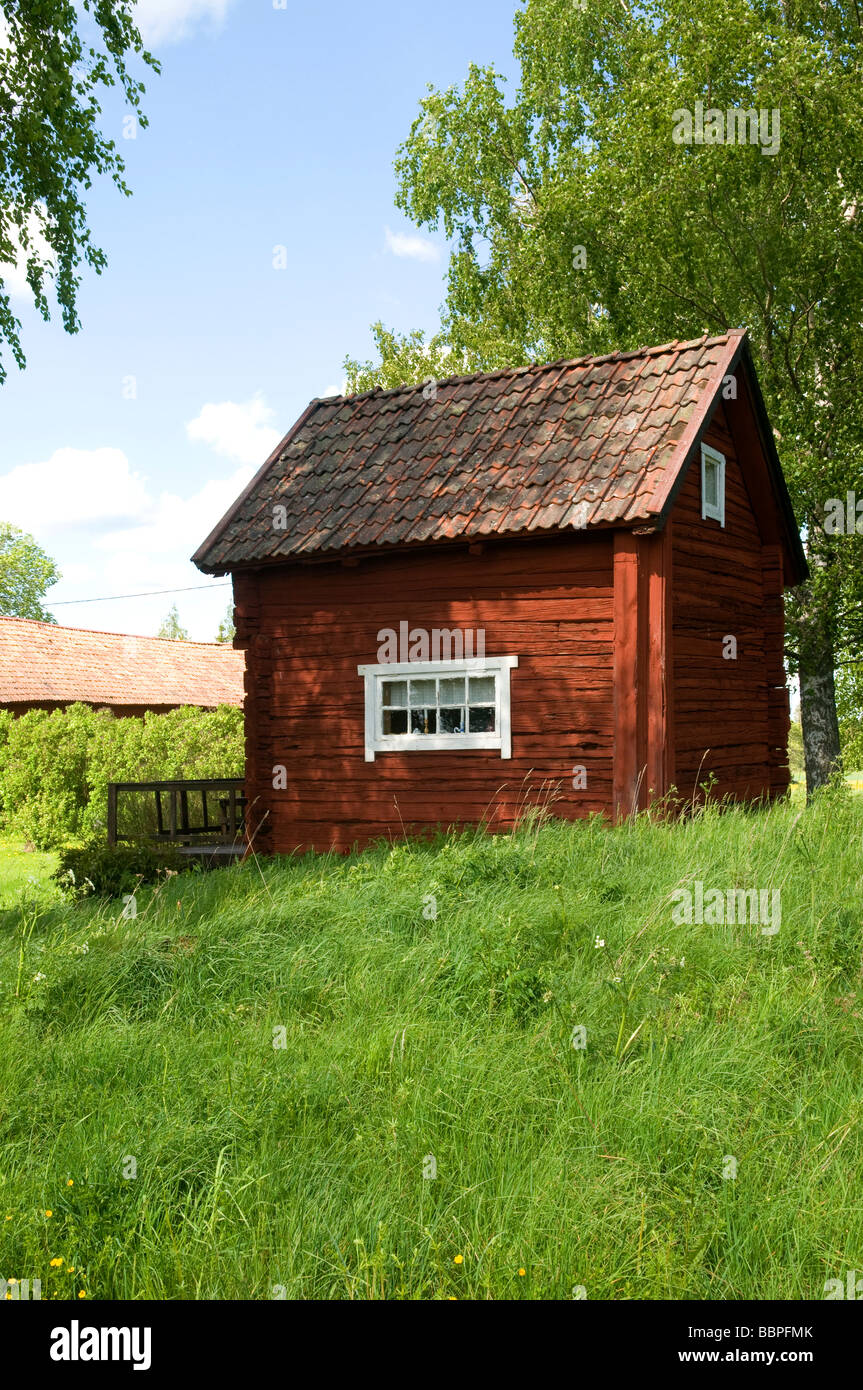 Red wooden house for storing hay Stock Photo - Alamy