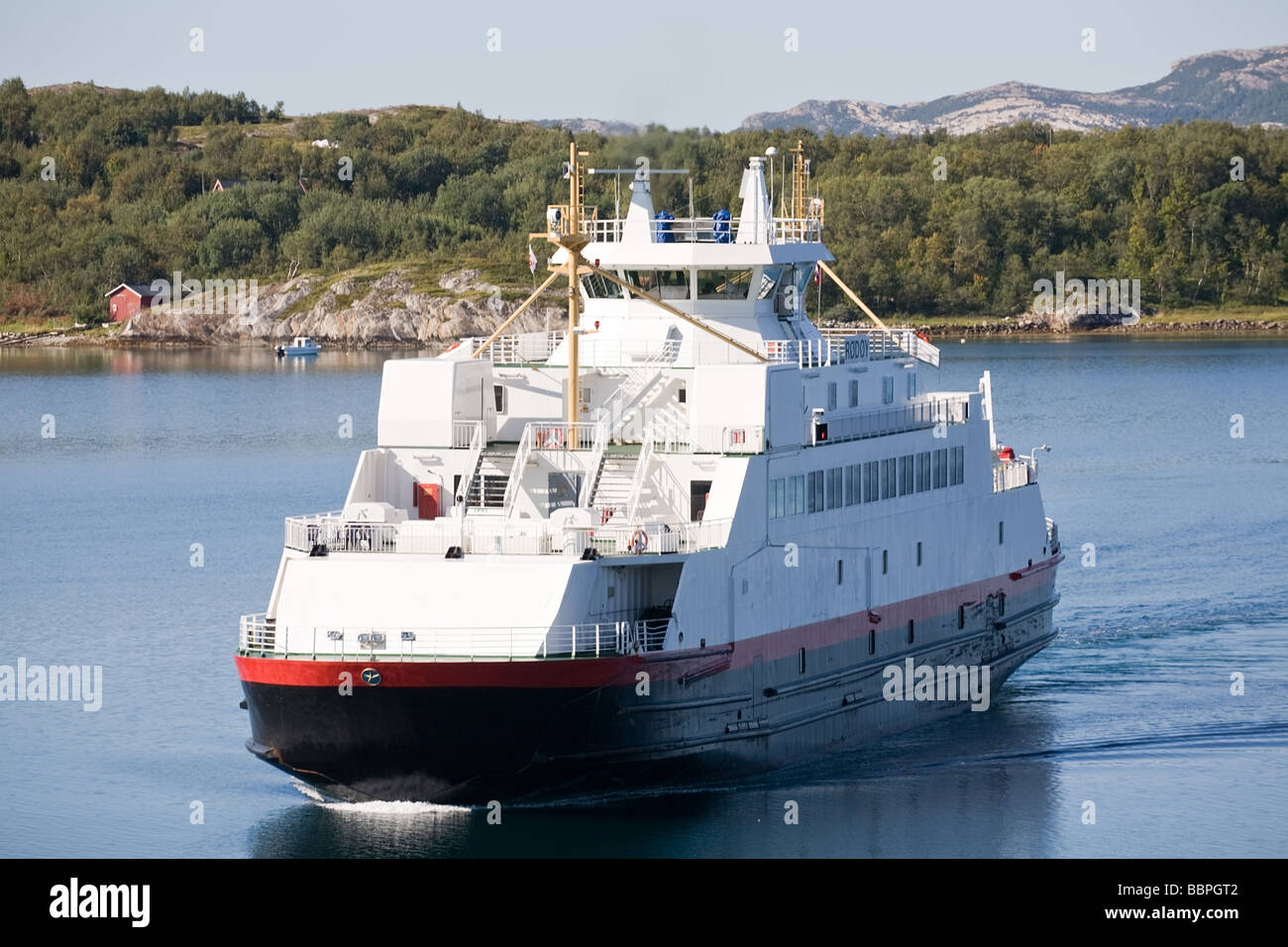 big norwegian ferry near rocky coast Stock Photo - Alamy