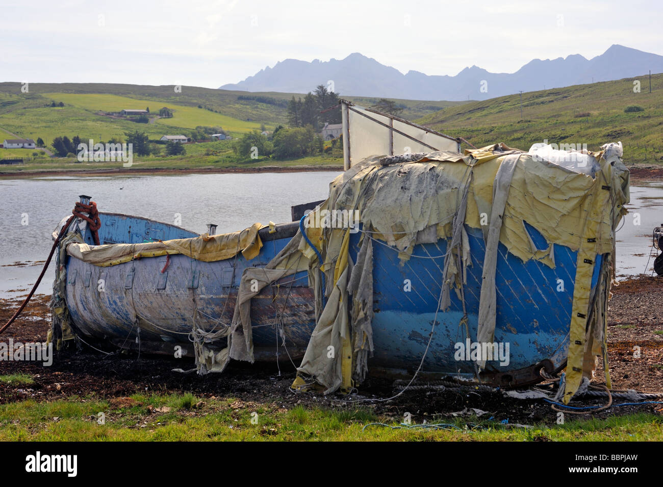 Beached, derelict, blue, wooden boat. Merkadale, Loch Harport ...
