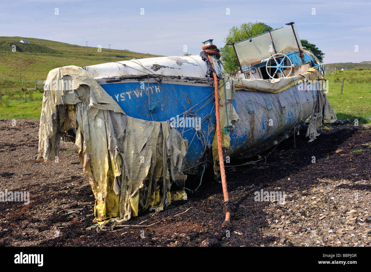 Beached, derelict, blue, wooden boat. Merkadale, Loch Harport ...