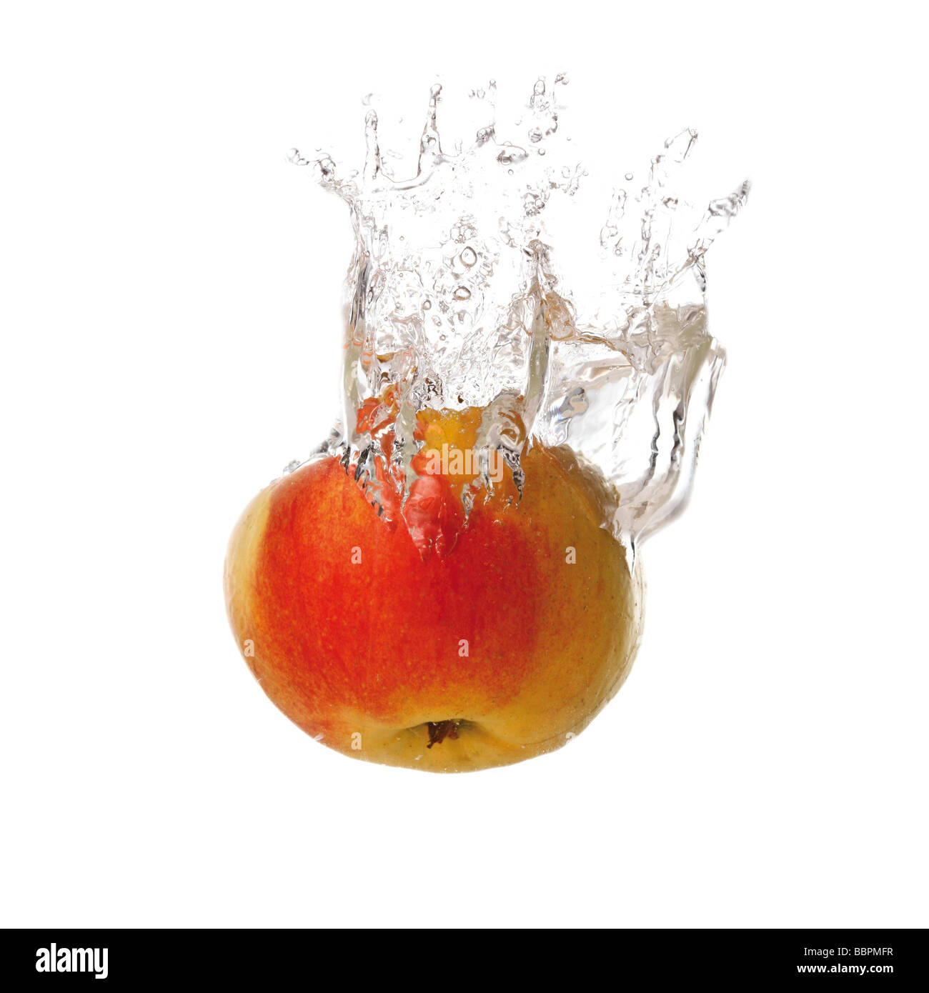 Apple dropping into water Stock Photo - Alamy