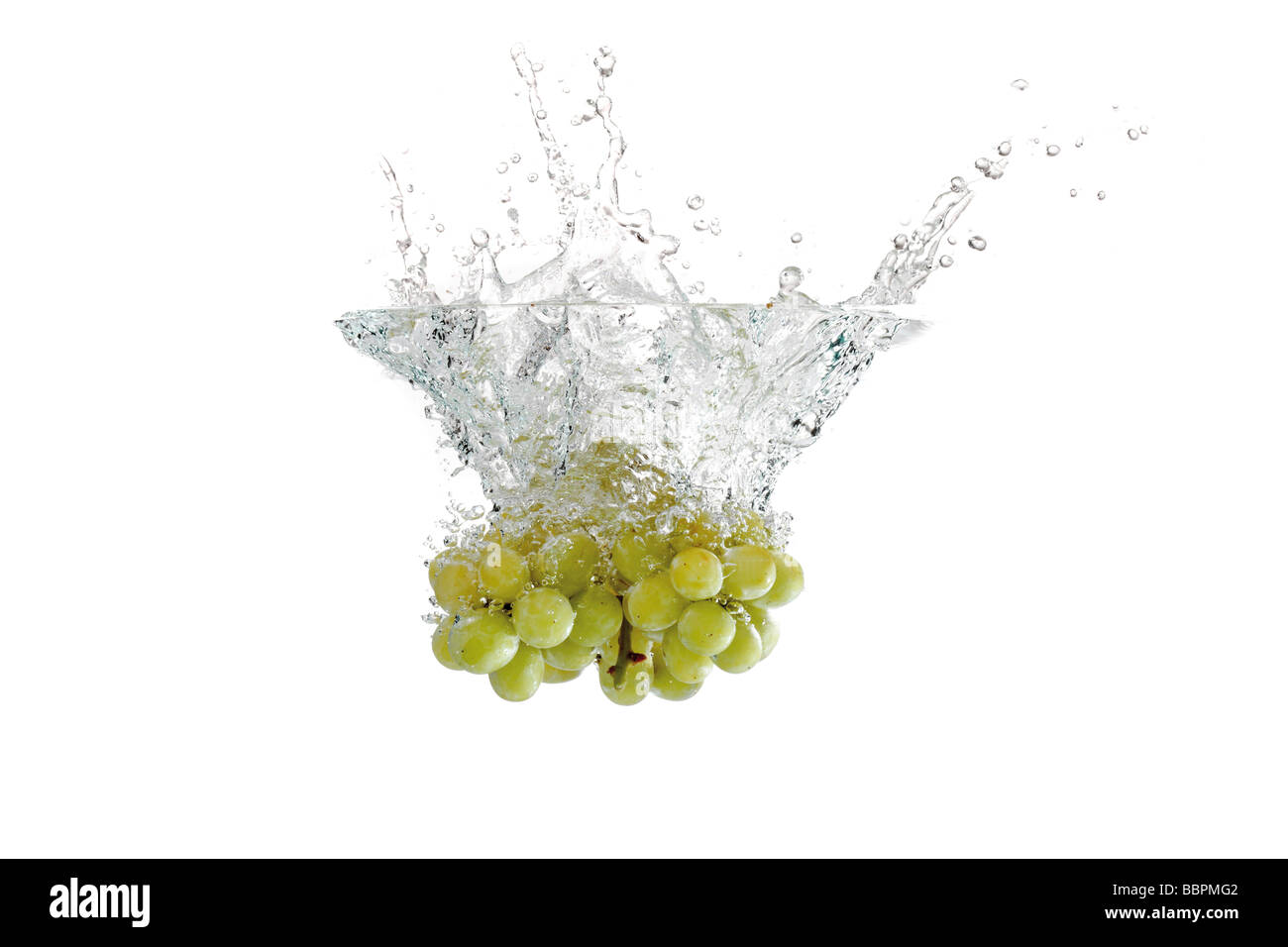 Grapes dropping into water Stock Photo - Alamy