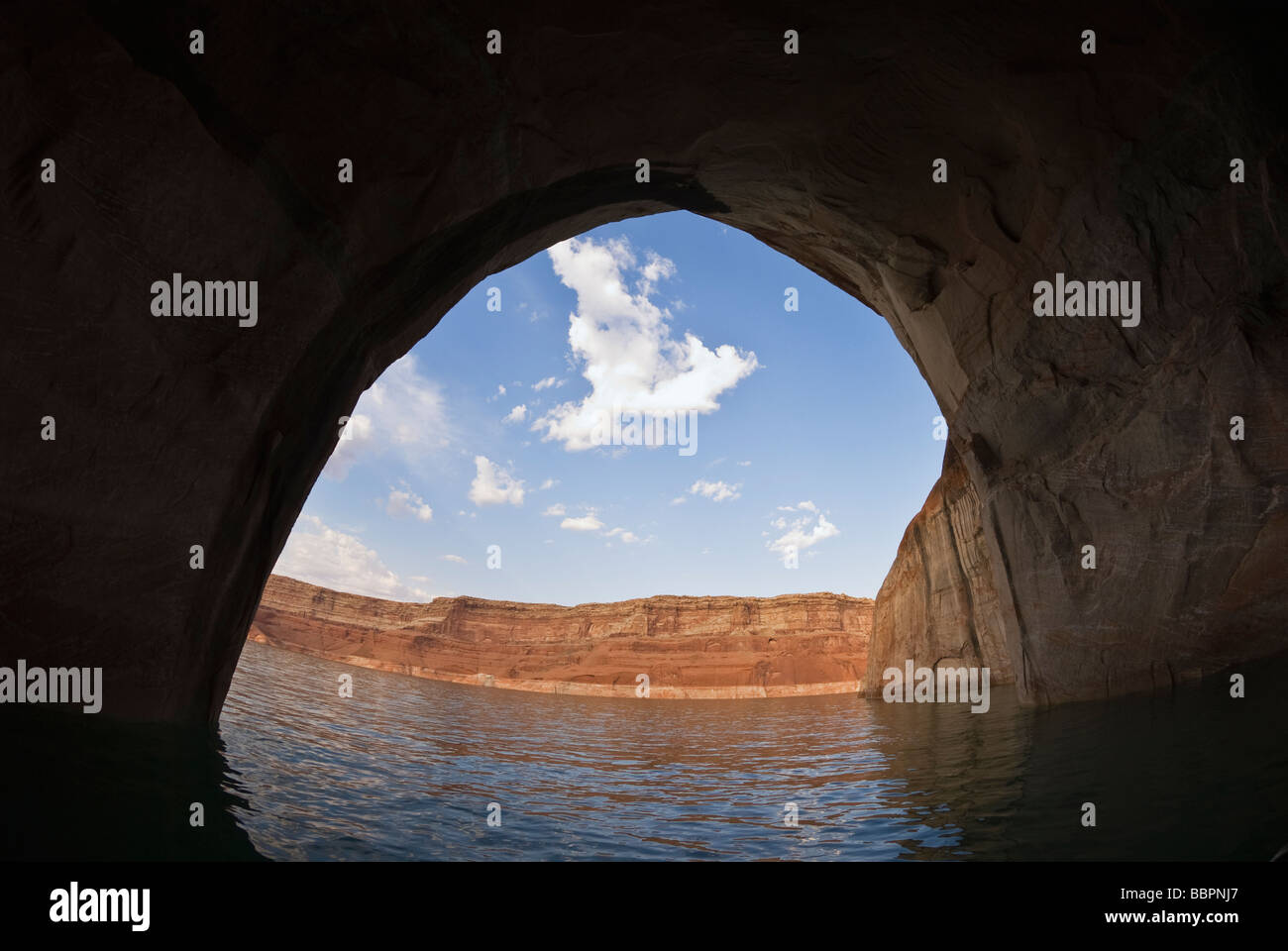 View from inside large sandstone cave, Lake Powell, Utah Stock Photo ...