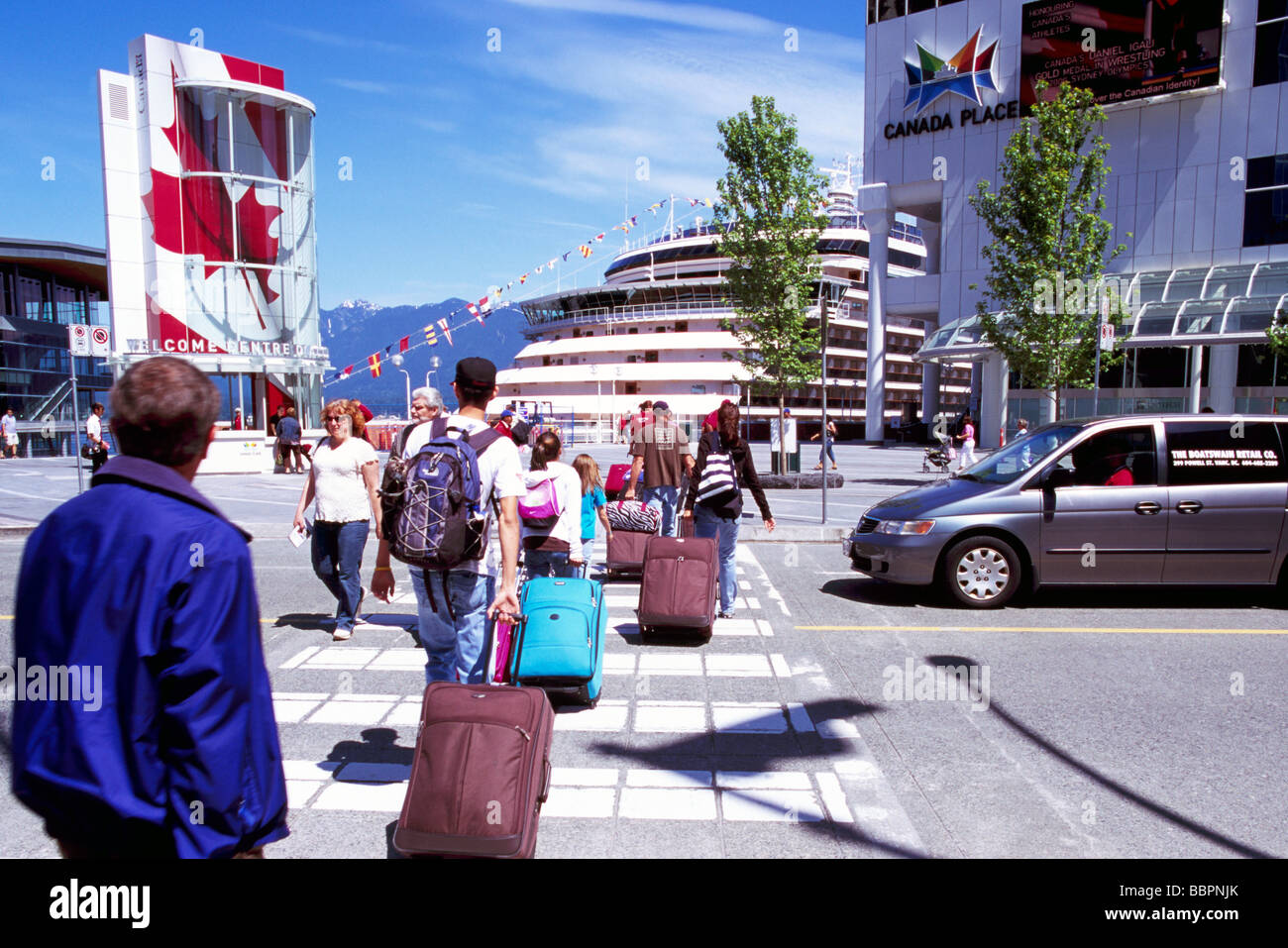 Tourists arriving at "Canada Place" Trade and Convention Centre and ...