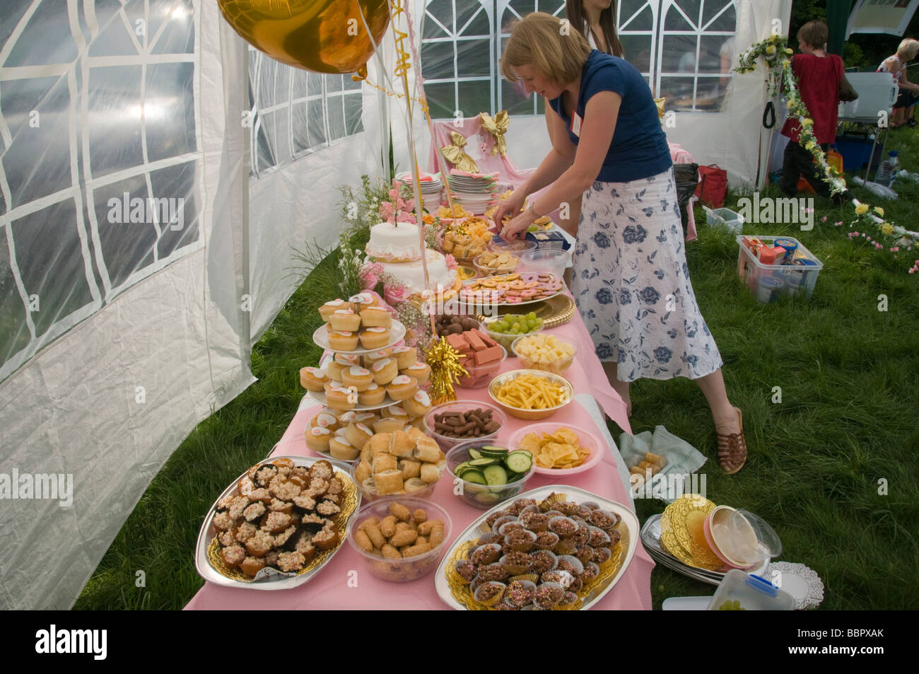 The London May Queen's other gets tea ready at the Merrie England and ...