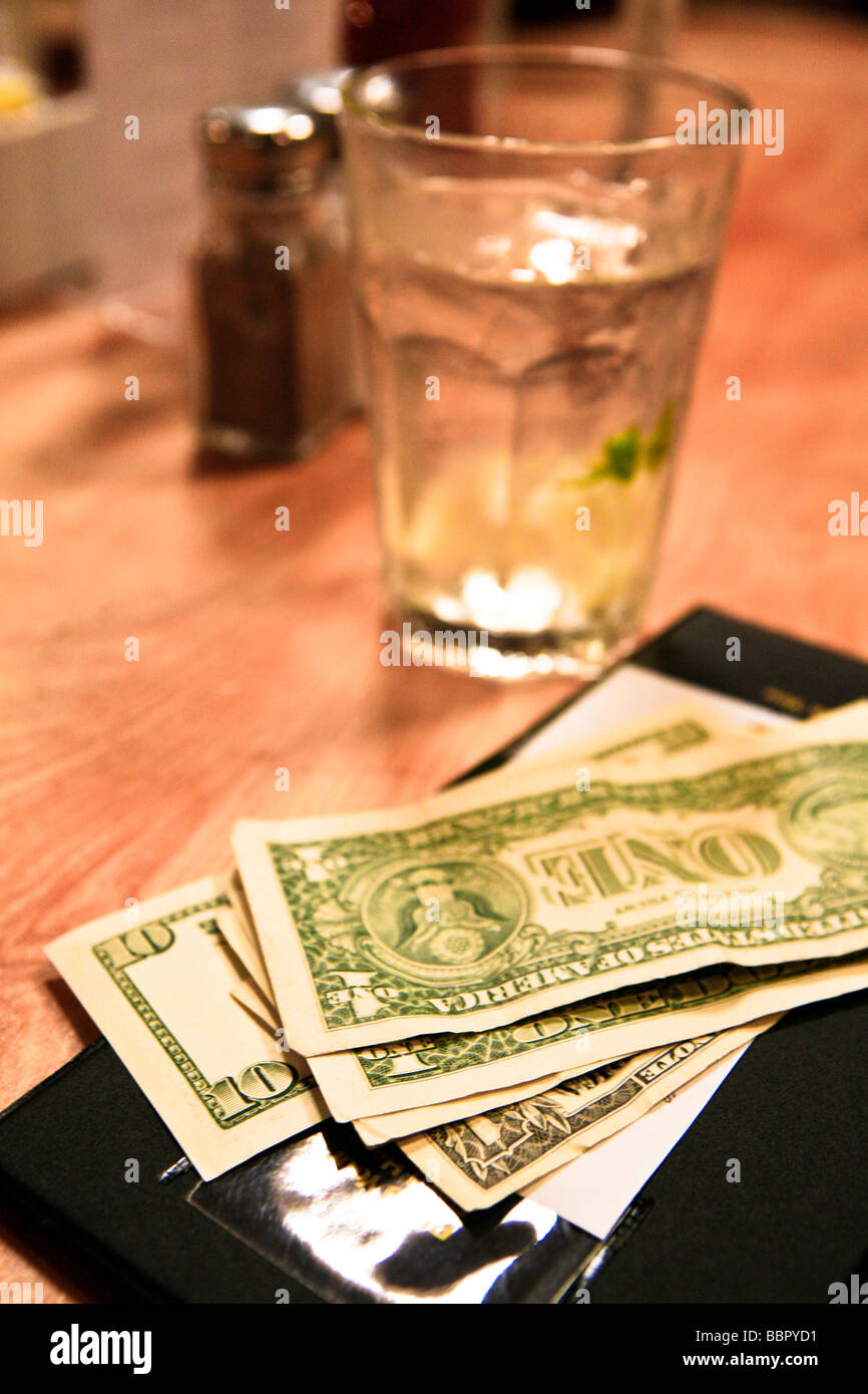 cocktail and dollars on a table Stock Photo - Alamy