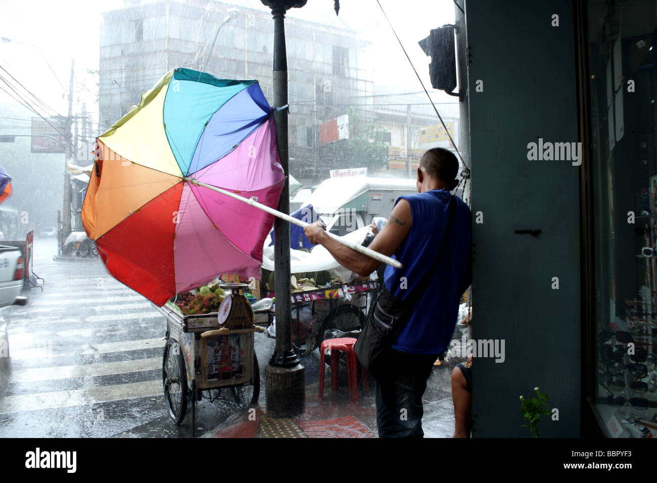 Bangkok moped rain hi-res stock photography and images - Alamy