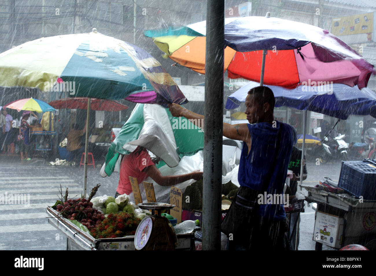 Bangkok moped rain hi-res stock photography and images - Alamy