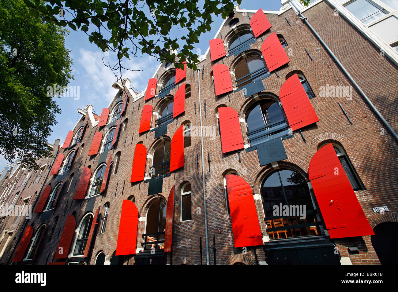 FACADE OF A TRADITIONAL HOUSE WITH ORANGE SHUTTERS Stock Photo - Alamy