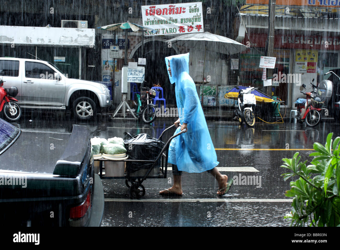 Bangkok moped rain hi-res stock photography and images - Alamy