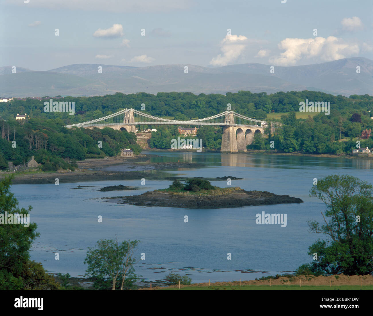 Menai Bridge over the Menai Strait, with mountains of Snowdonia beyond ...