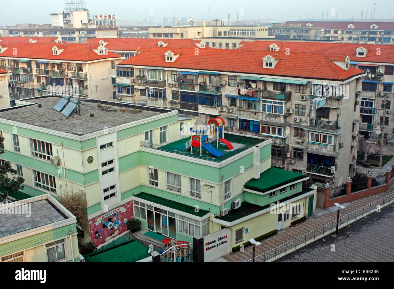 BUILDINGS AND A NURSERY SCHOOL, GAMES FOR CHILDREN ON THE SCHOOL'S ...