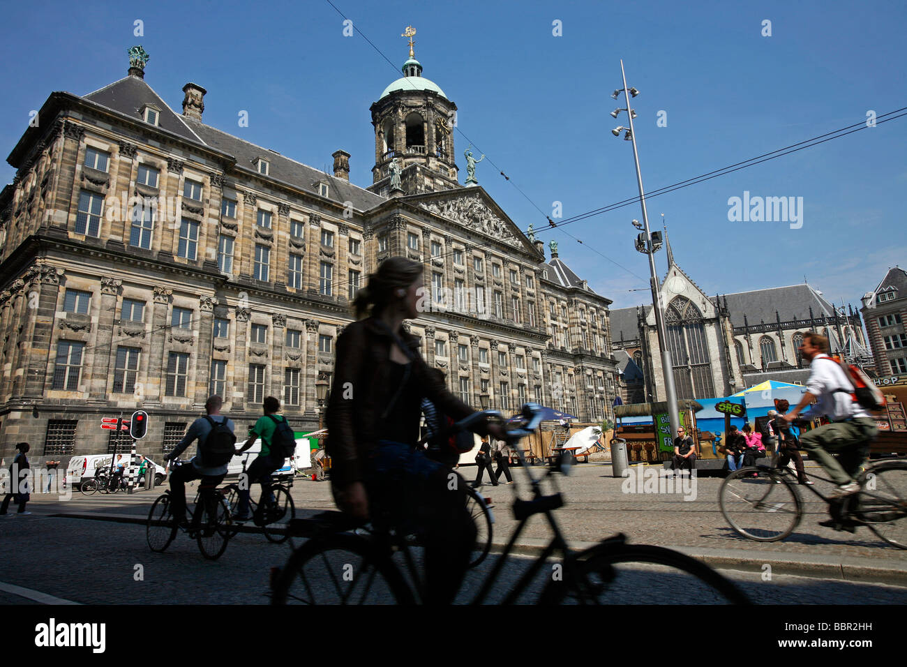 WOMAN ON A BIKE, ROYAL PALACE, KONINKLIJK PALEIS, DAM SQUARE, AMSTERDAM, NETHERLANDS, HOLLAND ...