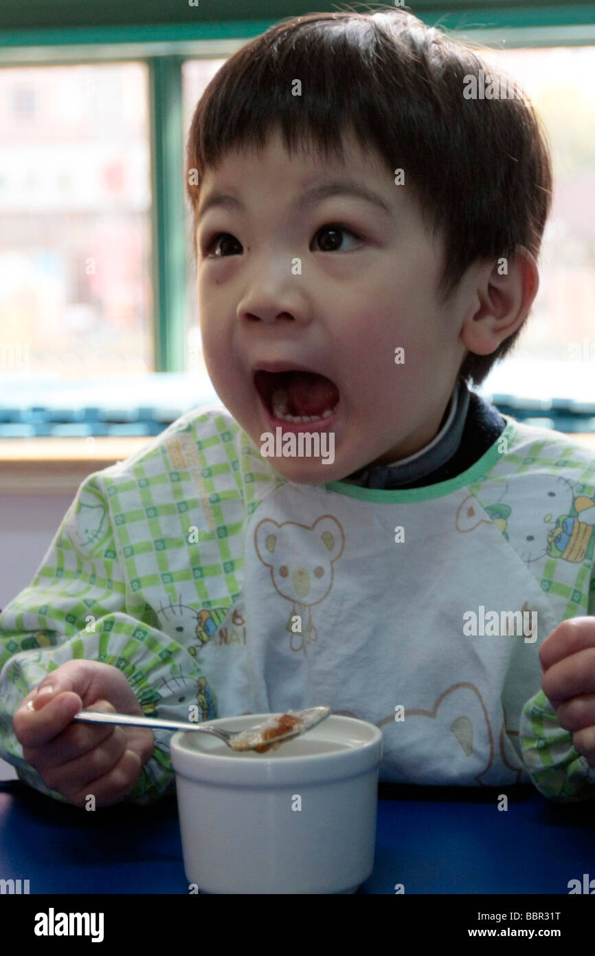 CHILD MAKING FACES IN THE CLASSROOM, KINDER CLUB SCHOOL IN SHANGHAI ...