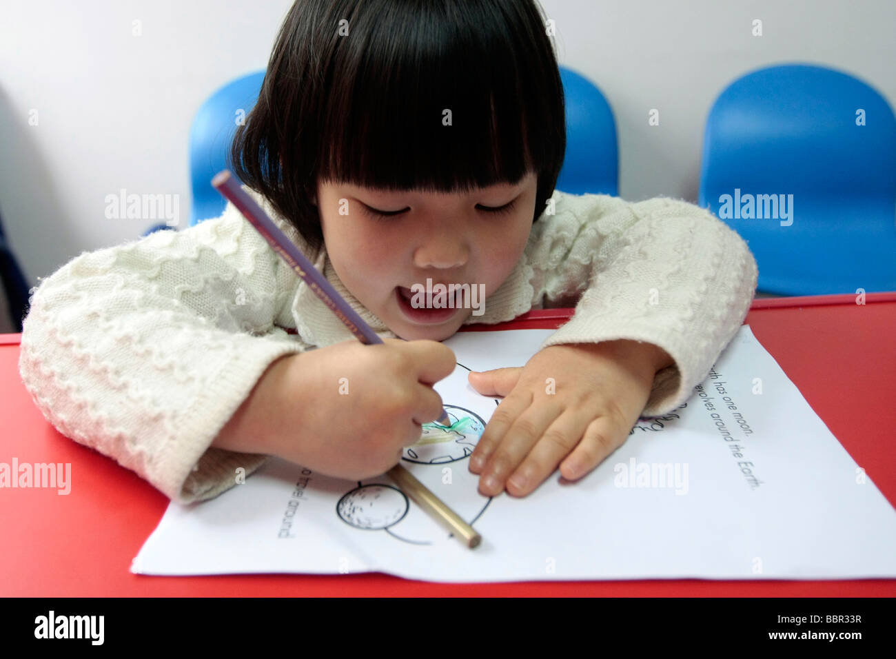 CHILD WORKING IN THE CLASSROOM, KINDER CLUB SCHOOL IN SHANGHAI, CHINA ...