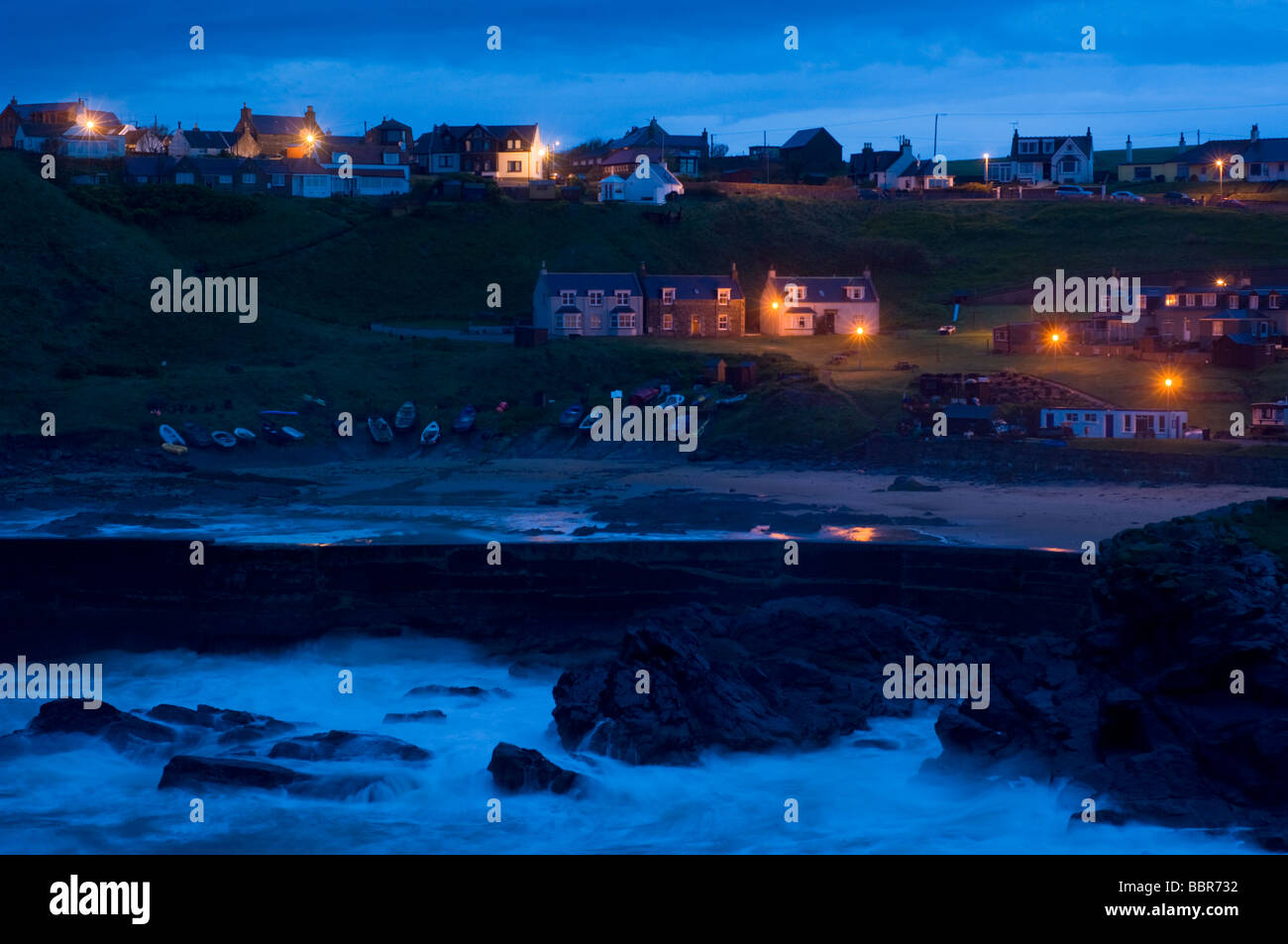 Stormy waves at the traditional fishing village and harbour of ...