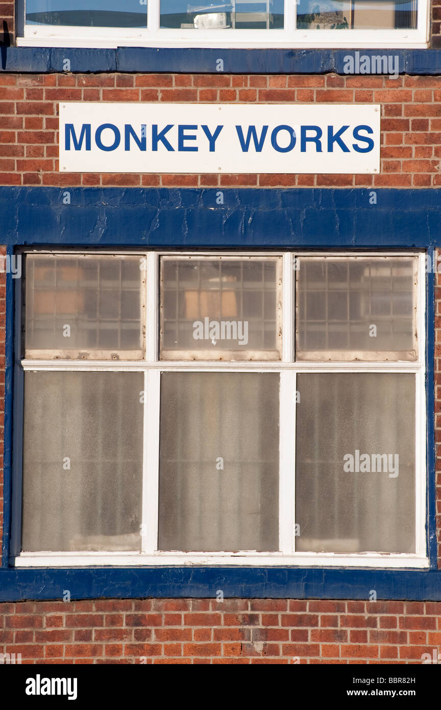 "Monkey Works" funny sign on a wall Stock Photo - Alamy