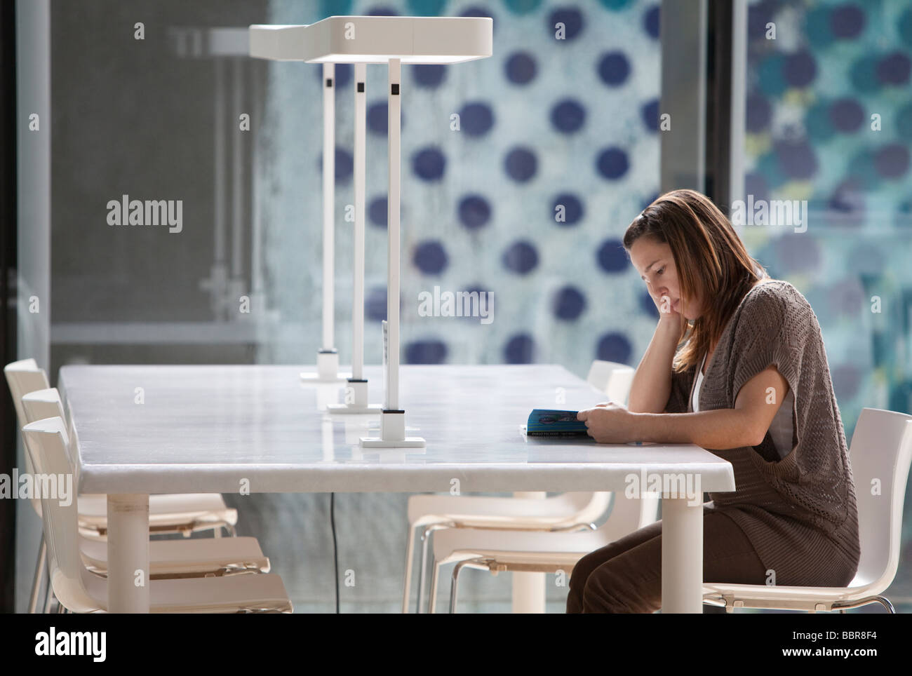 girl reading in library Stock Photo - Alamy