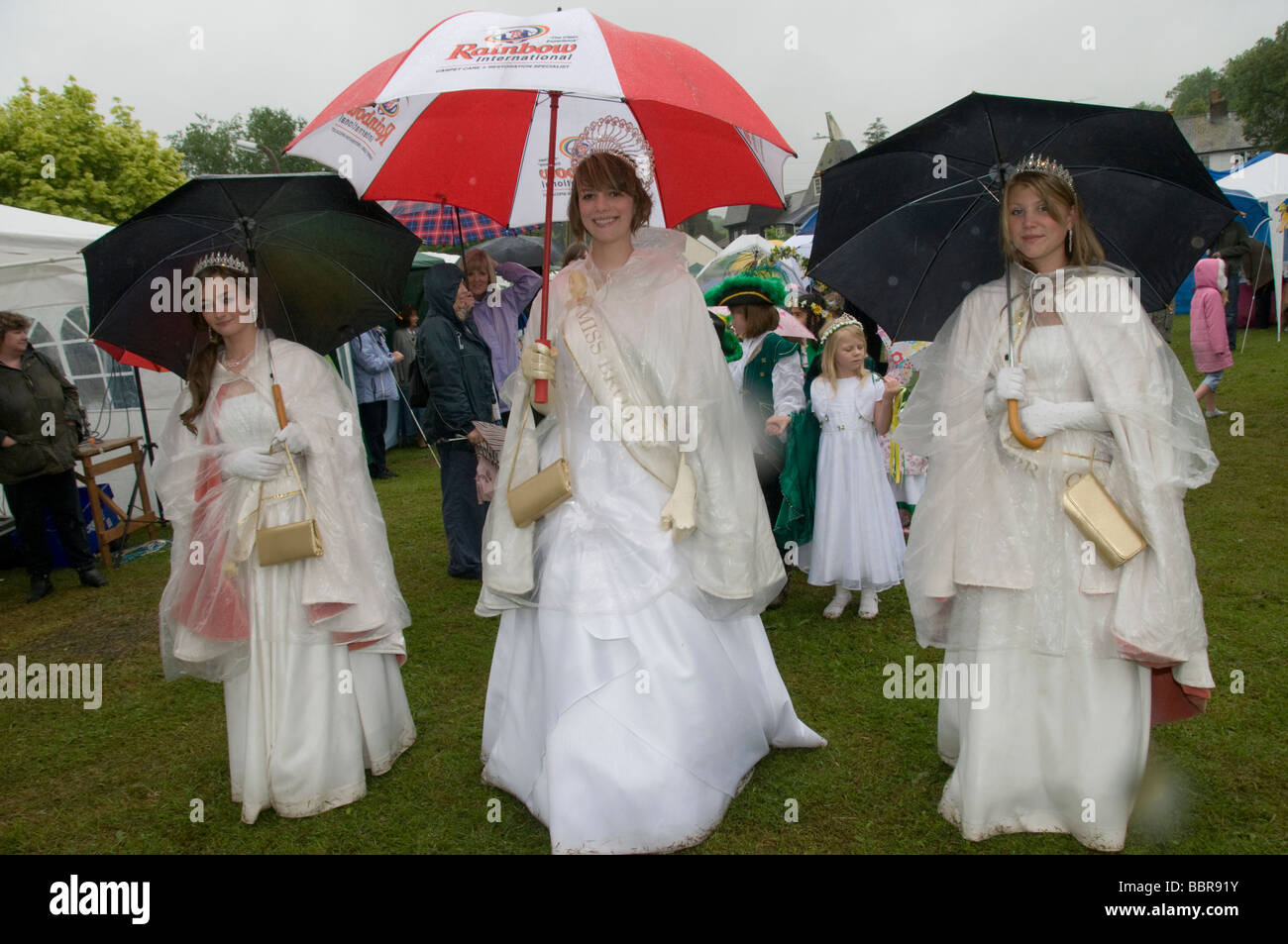Miss Bromley and her senior princesses hold umbrellas at the Pratts ...