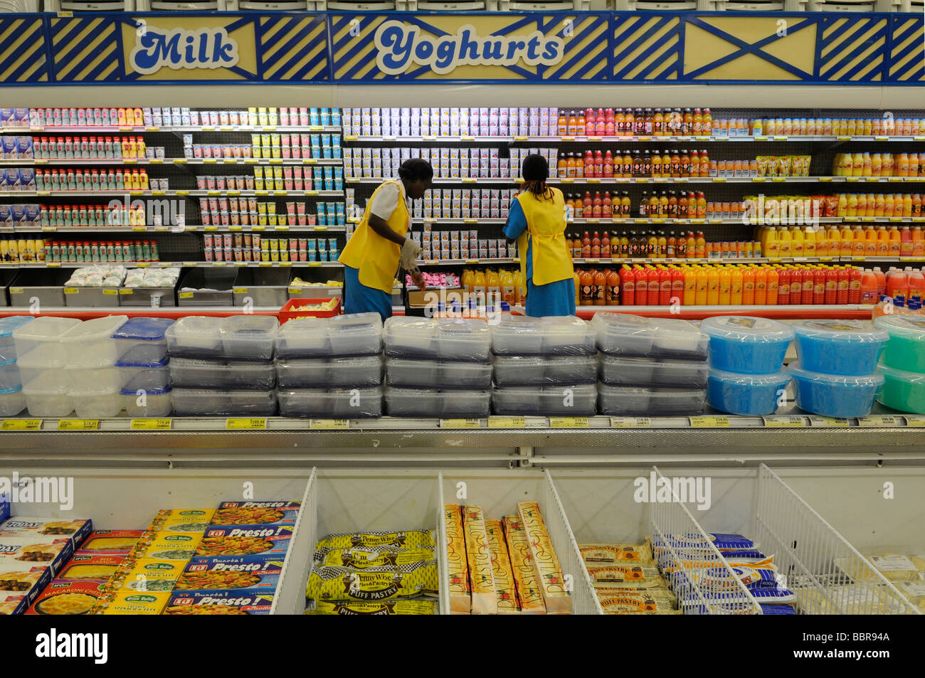 Workers stocking shelves in a supermarket, Lilongwe capital of Malawi ...